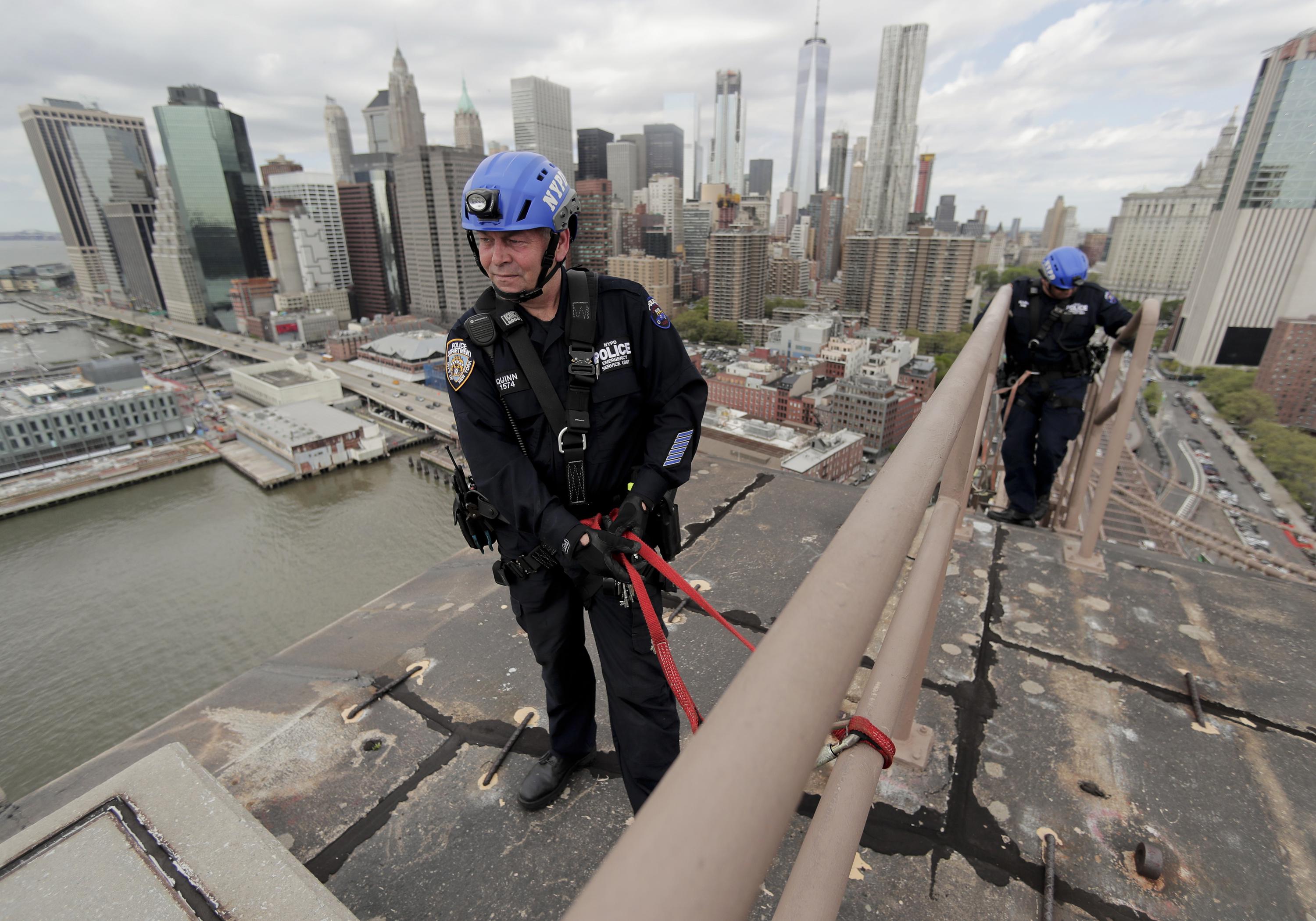 Don't look down! NYPD unit does its work at dizzying heights | AP News