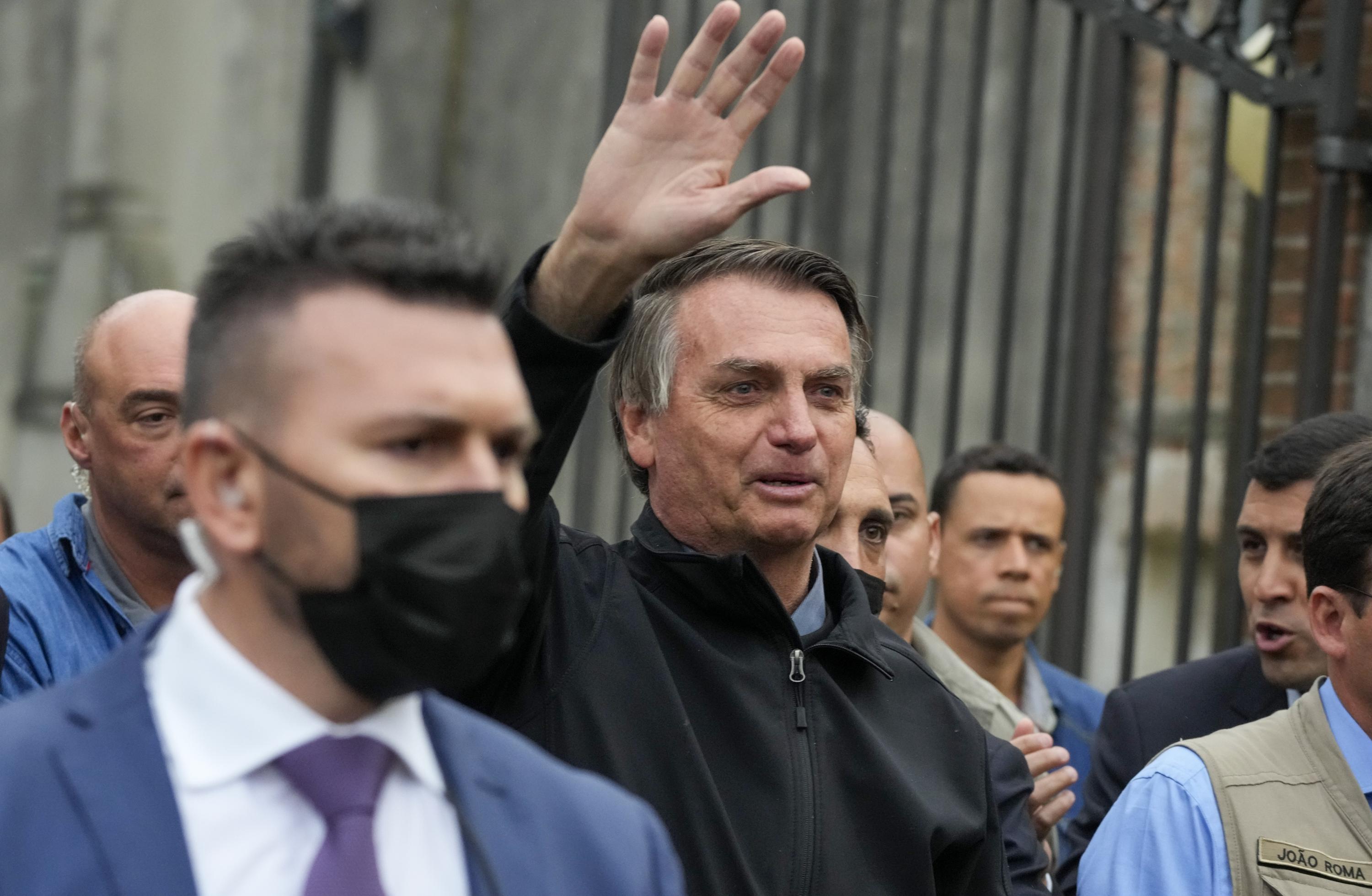 Brazil's Bolsonaro cheered, jeered in Italian town for honor | AP News