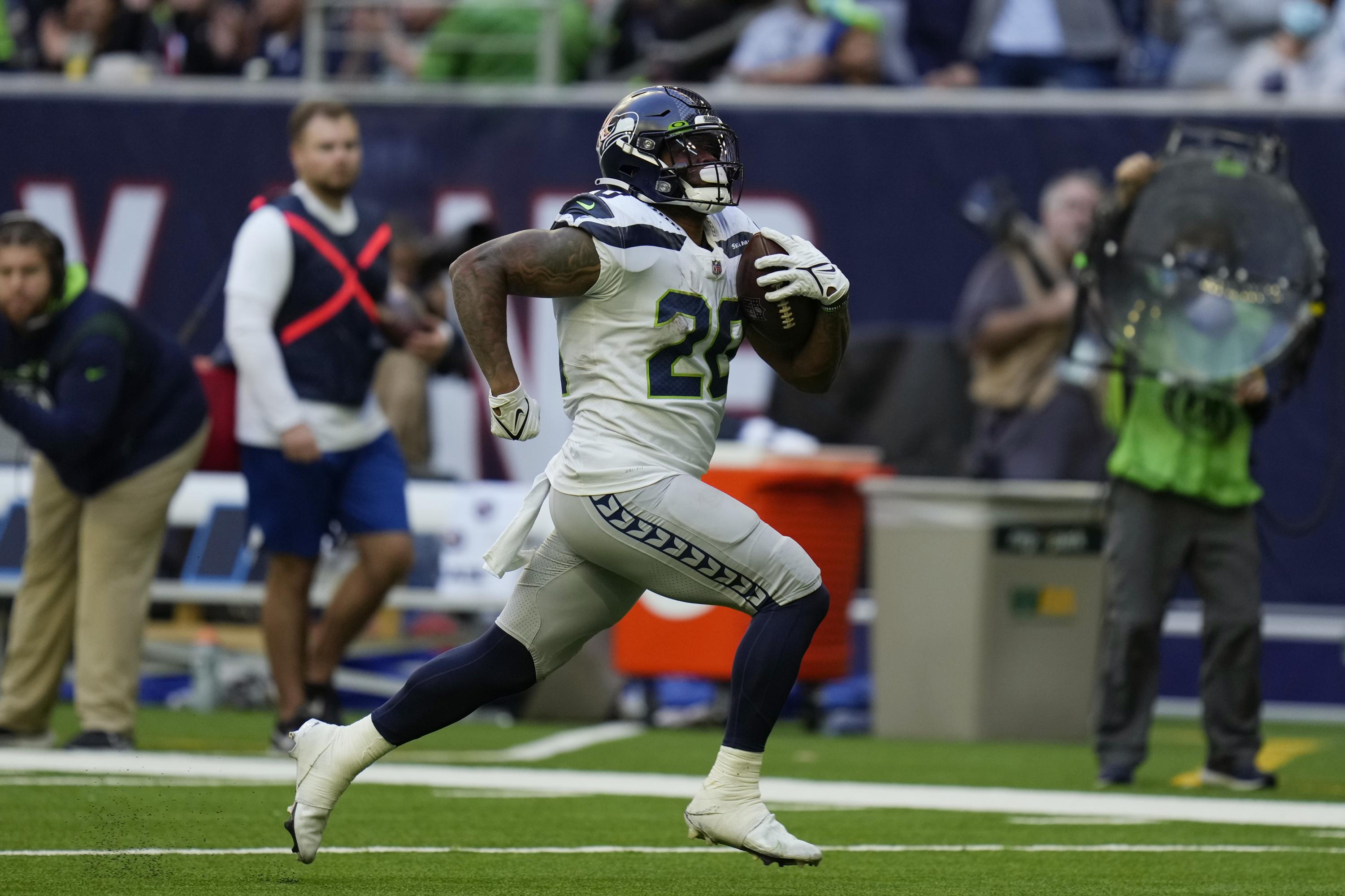 Wilson y Seahawks doblegan 33-13 a Texans | AP News