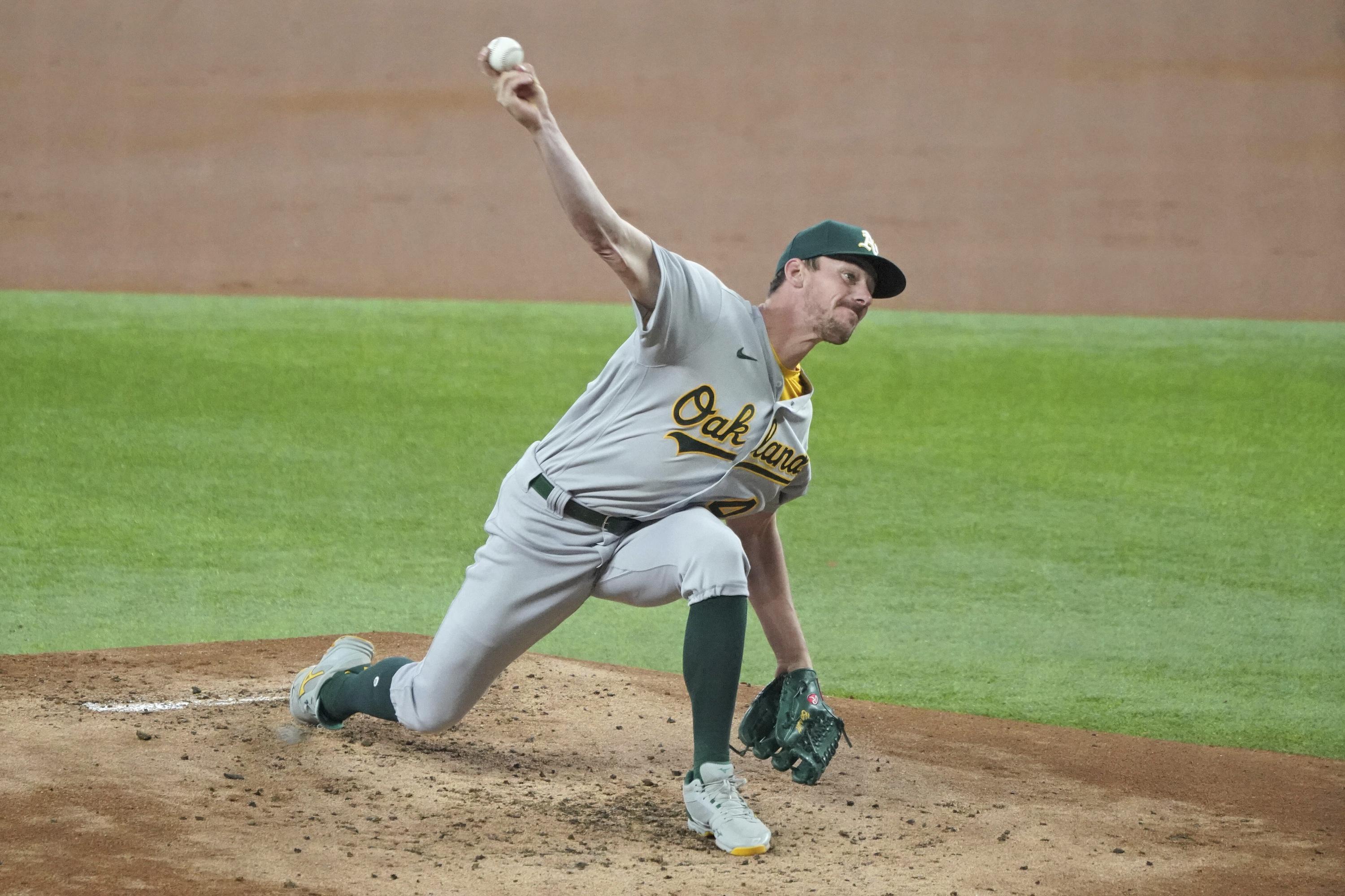 A's split with 5-1 win in Texas as Bassitt gets 8th W in row