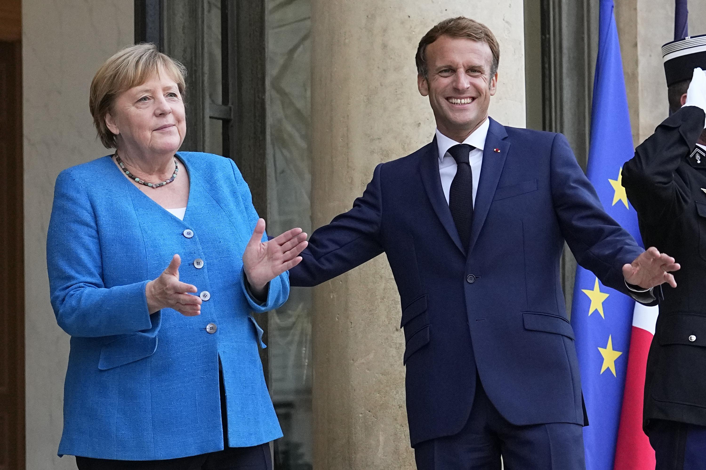 Macron, Merkel meet in Paris on world's crises, EU issues | AP News