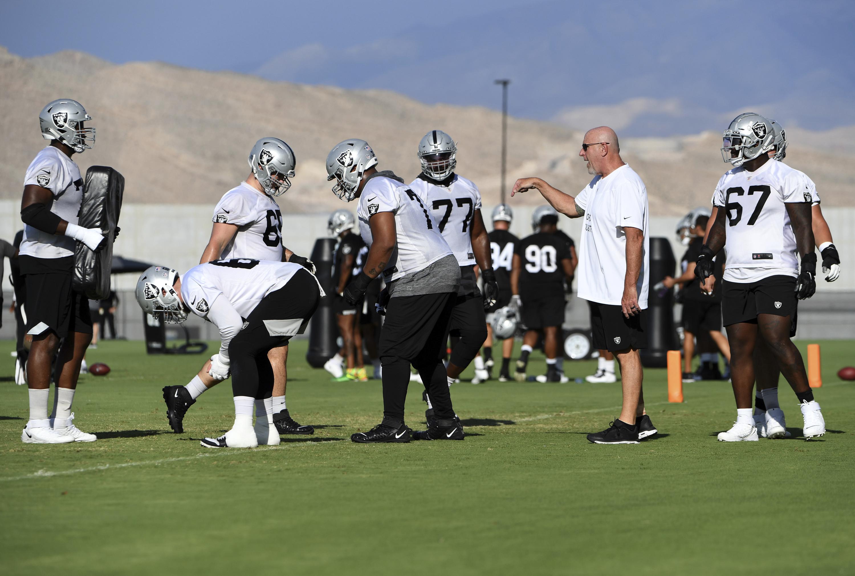 Raiders' rebuilt offensive line coming together in camp | AP News