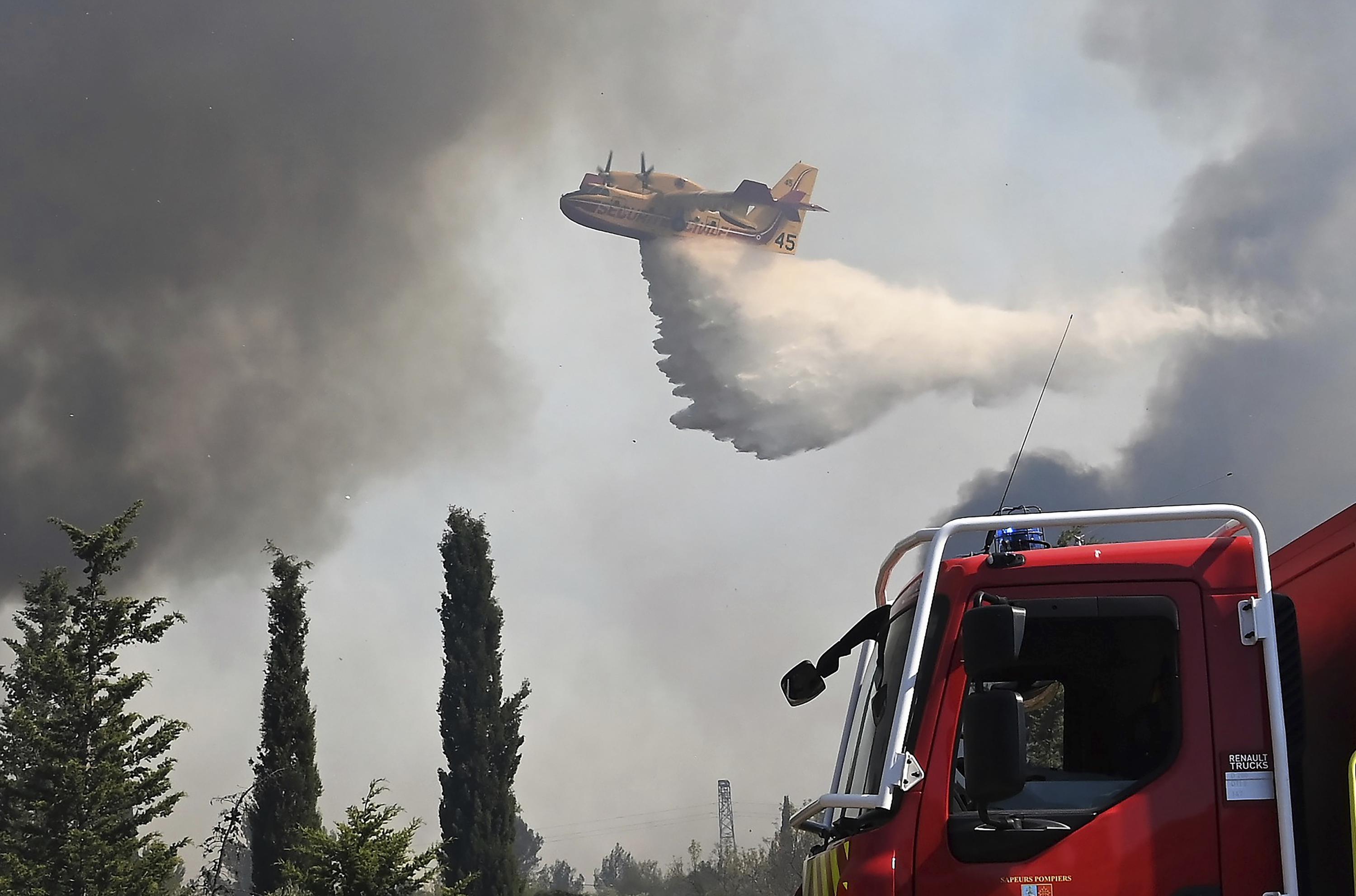 Blaze contained in southern France but 4 firefighters hurt | AP News
