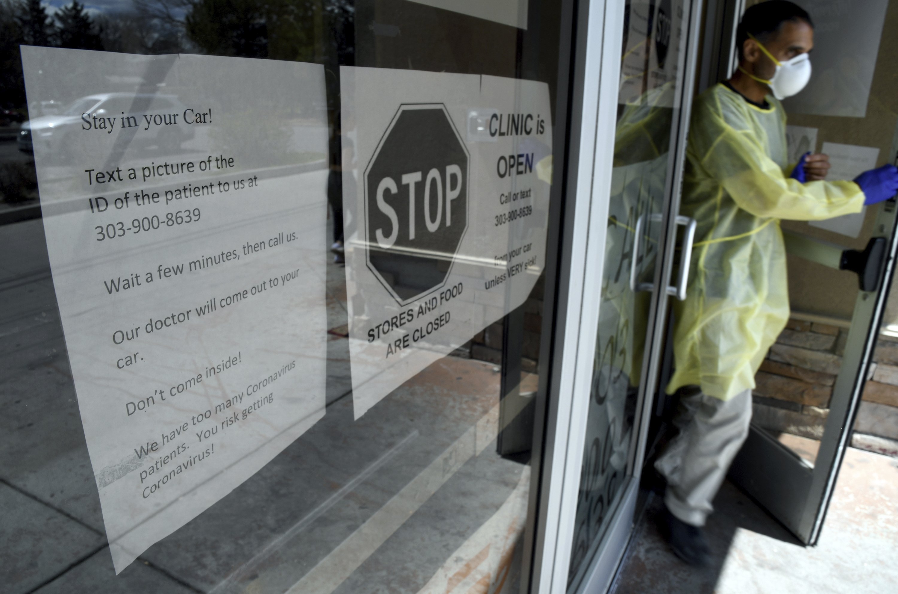 Video shows officer point gun at doctor on his own property | AP News