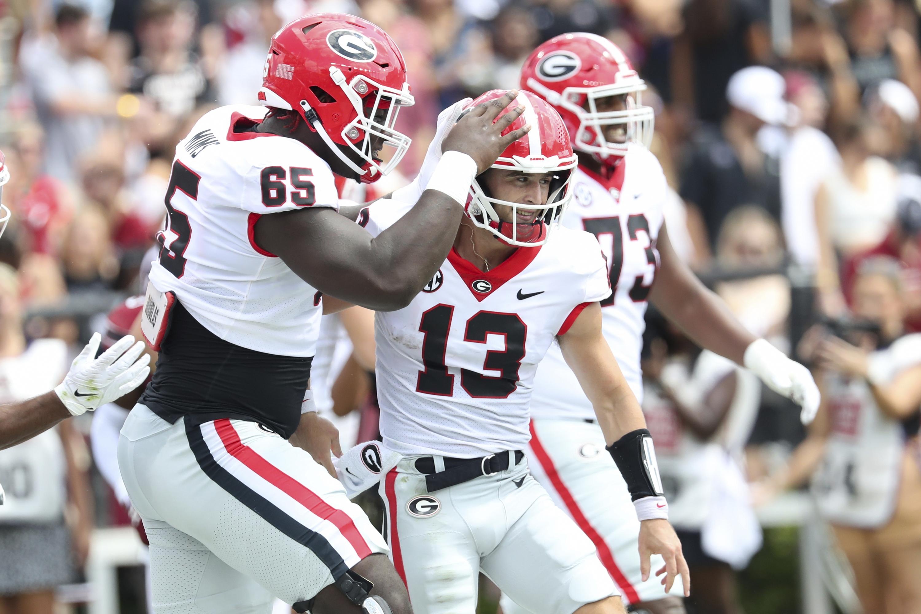 Bennett, No. 1 Georgia's D steamrolls South Carolina 48-7 | AP News