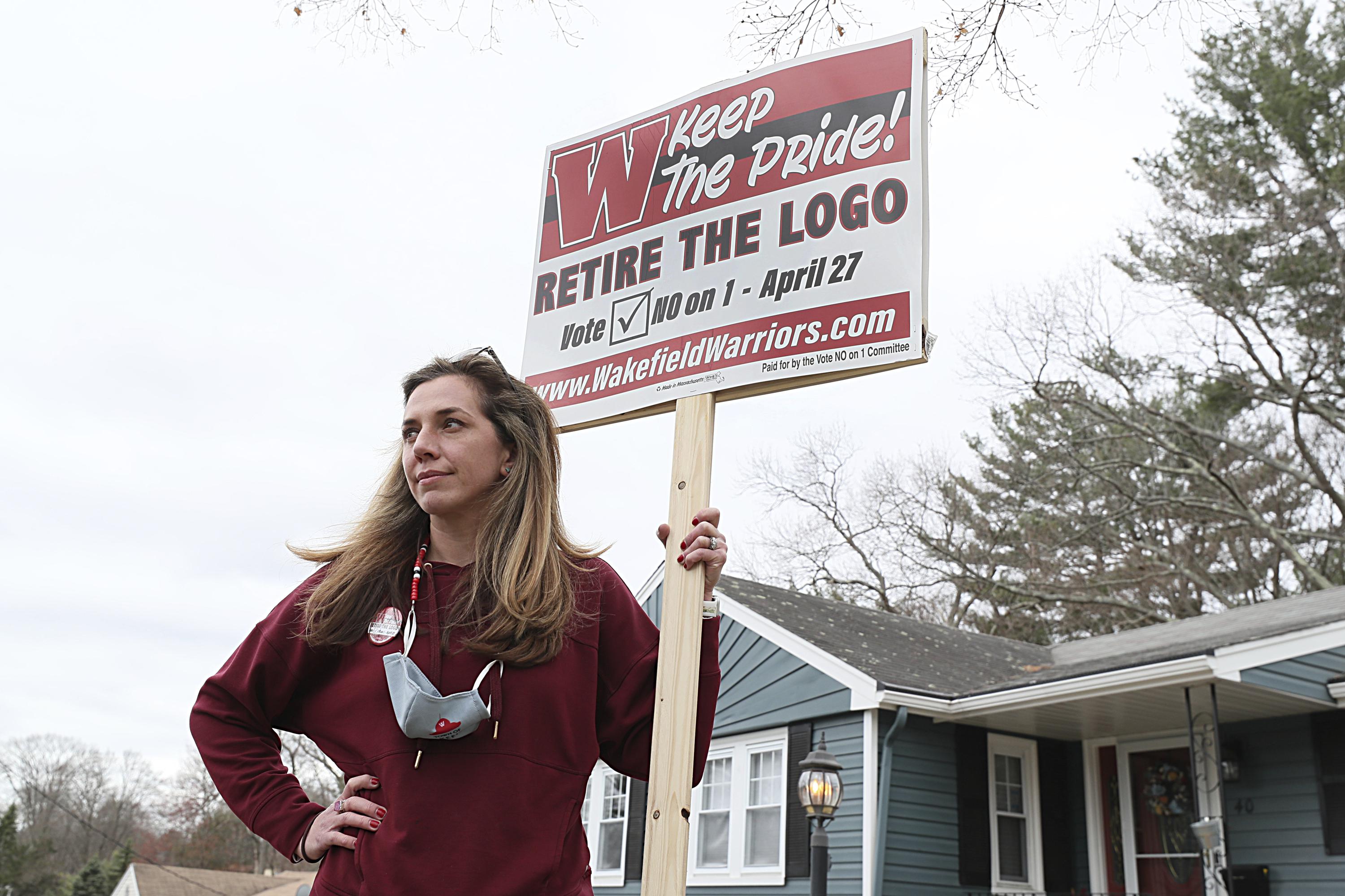 Residents vote to keep school’s Native American logo | AP News