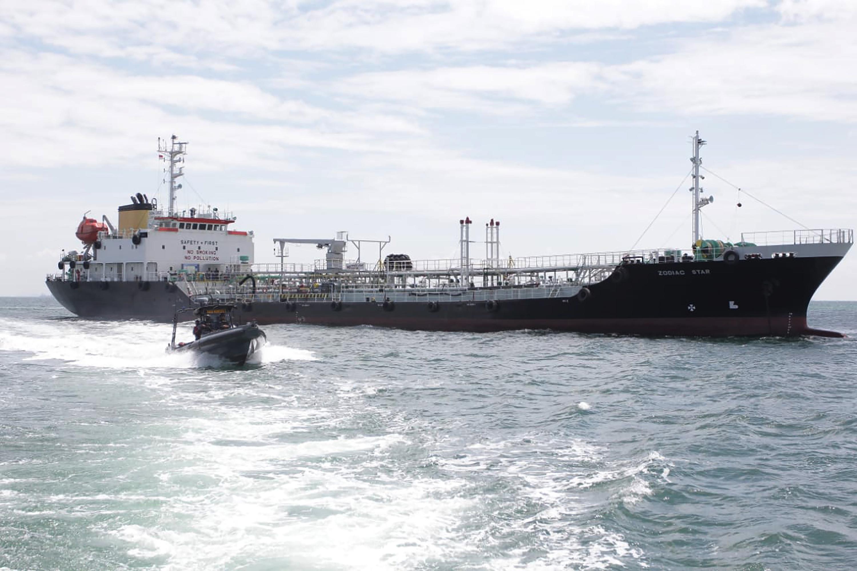 Indonesia seizes tanker believed to carry illicit waste oil | AP News