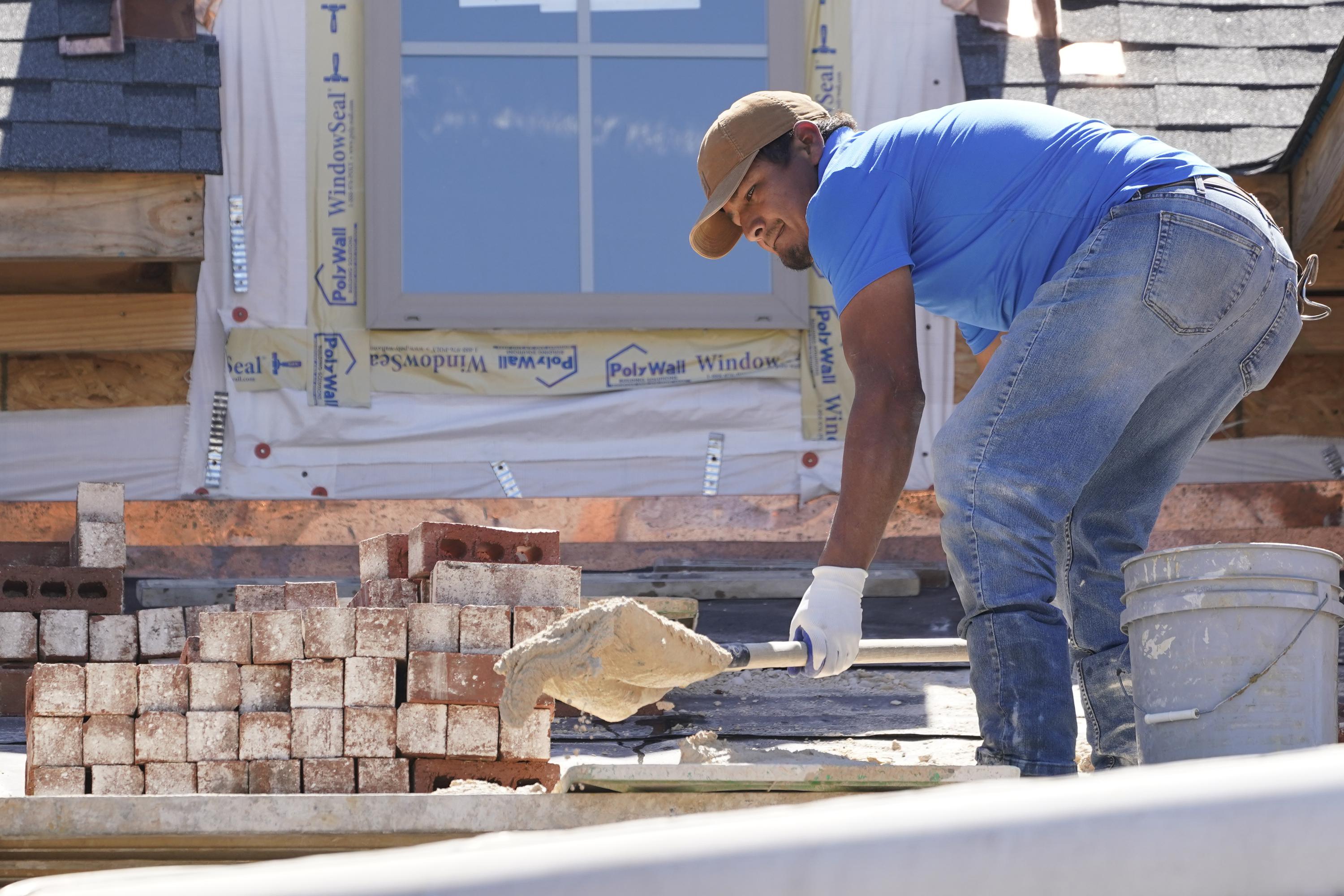 US home construction dips 0.7% in October, but permits jump | AP News