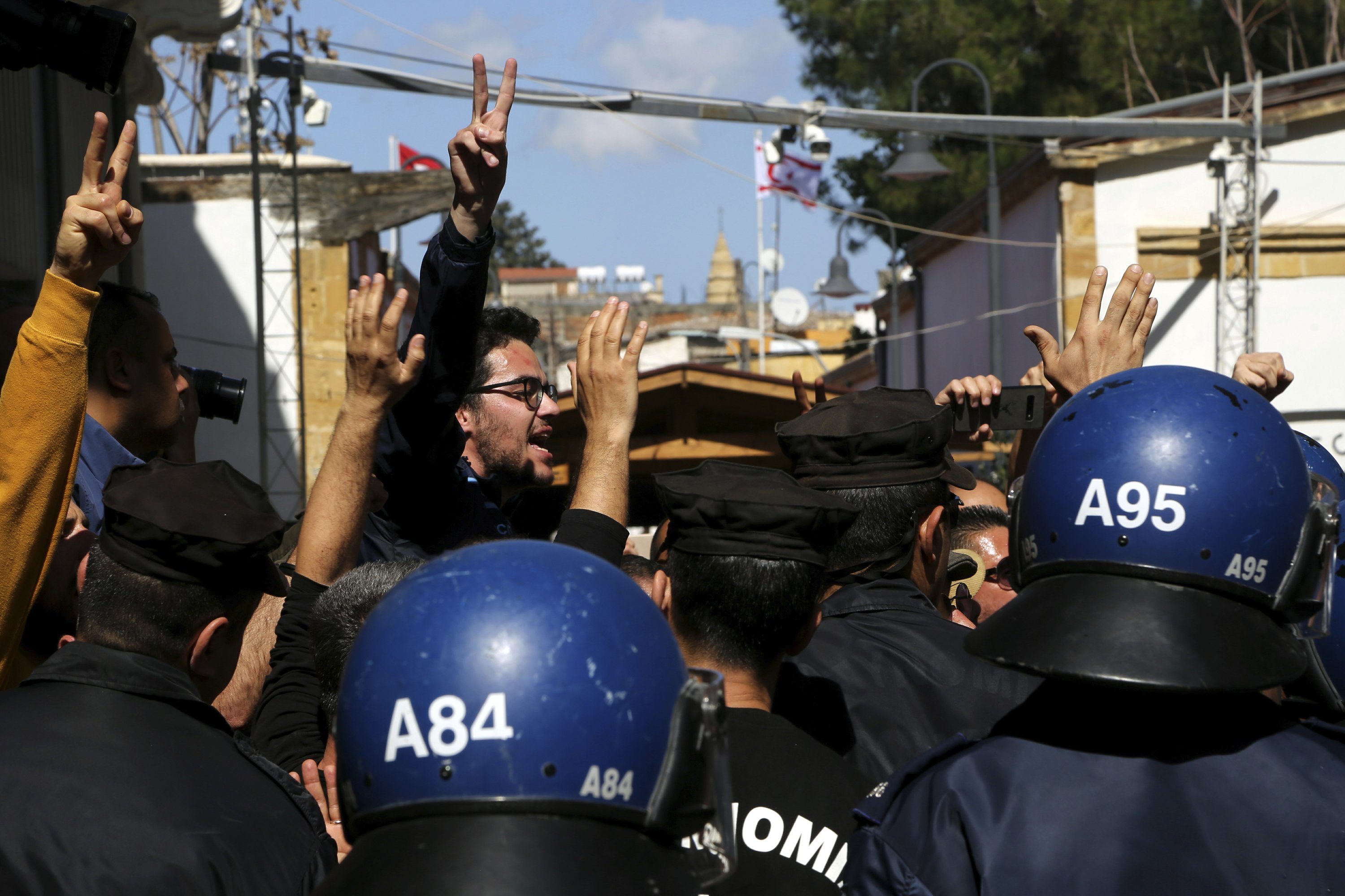 Cyprus police pepper spray protesters at shut crossing point | AP News