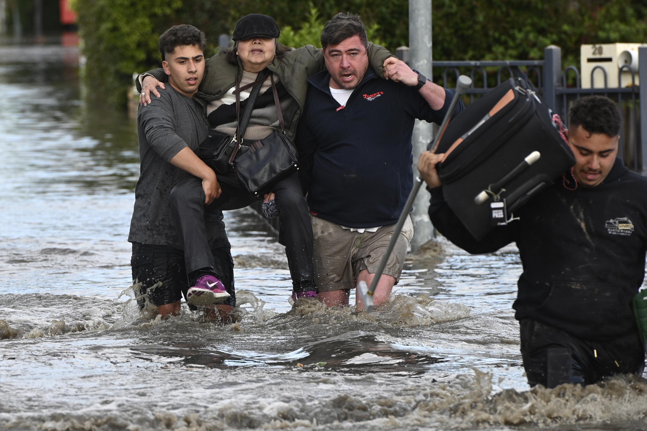 Homes inundated by swollen rivers in Australian floods | AP News