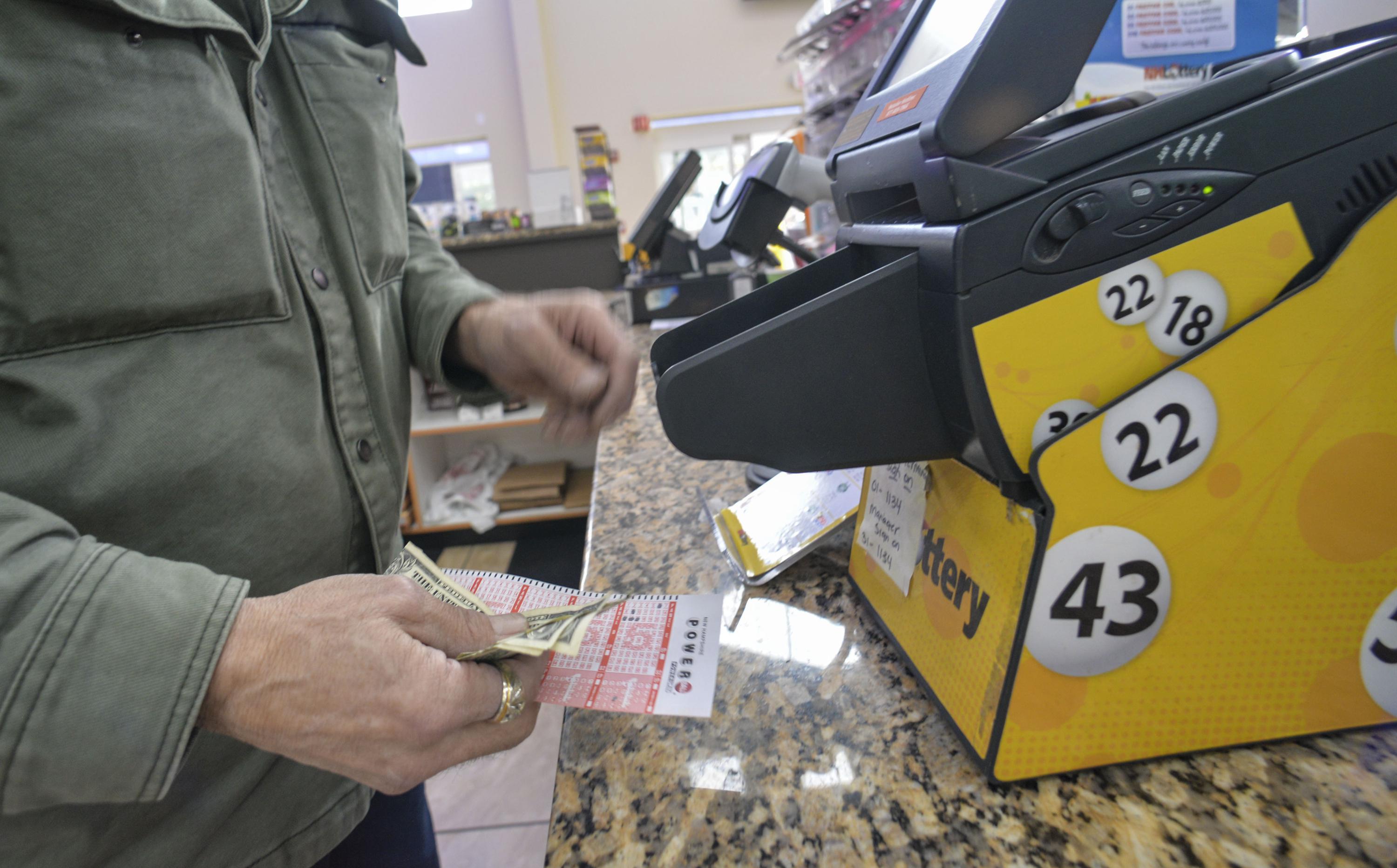 Powerball jackpot up to $1.6 billion, new lottery record | AP News
