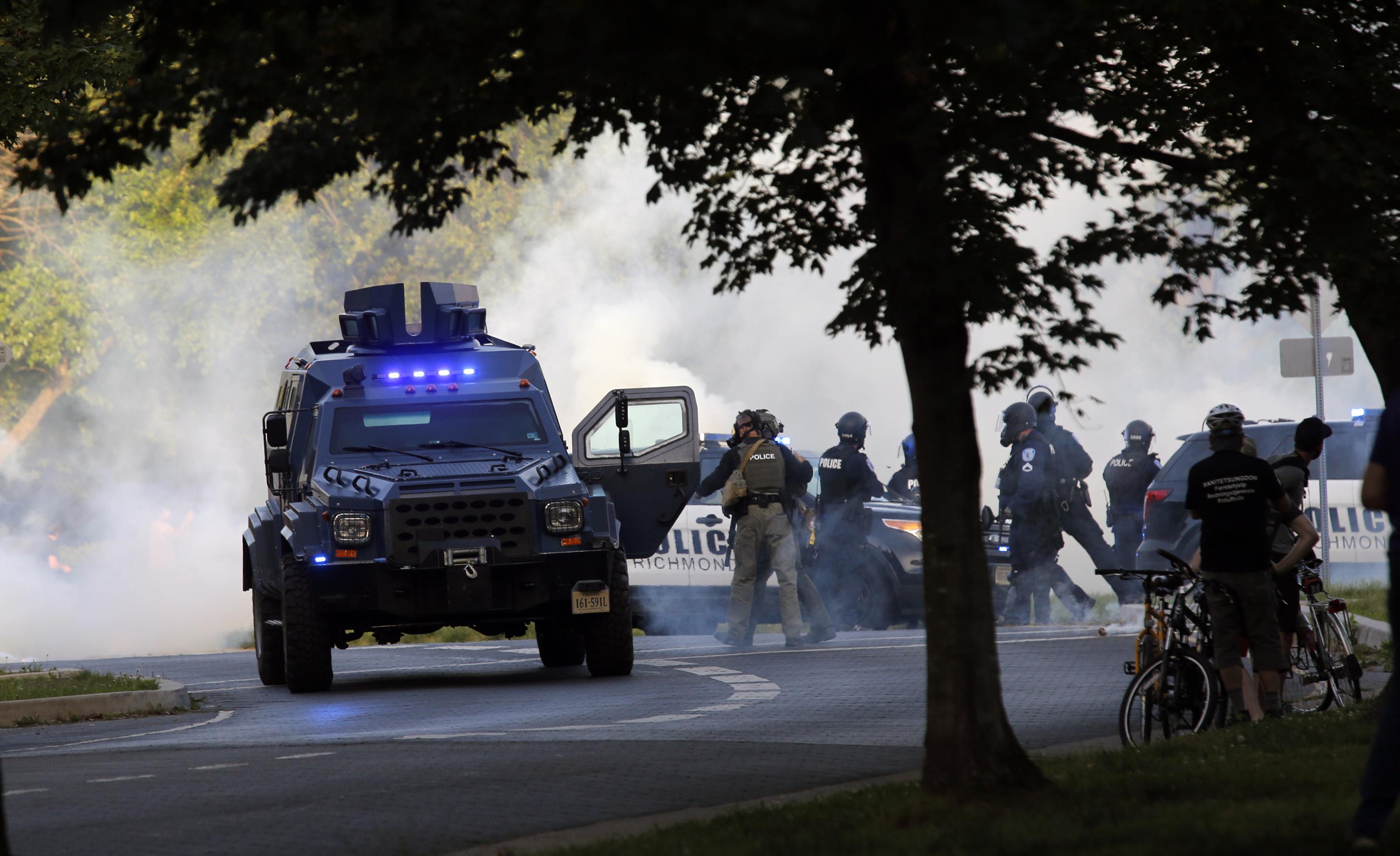 Tear-gassed protesters reach settlement with Richmond police | AP News