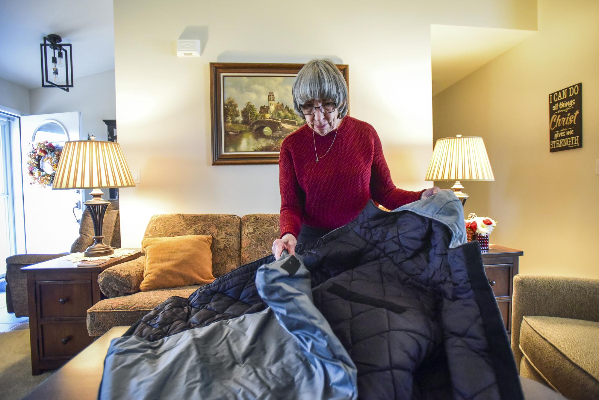 ‘The Bag Lady’ helps keep homeless warm with winter jackets | AP News