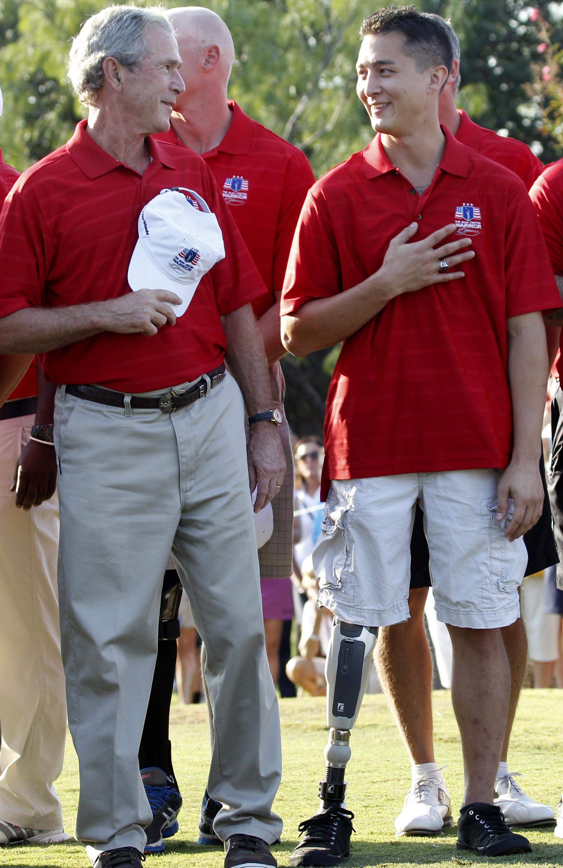 Bush hosts golf tournament for wounded veterans | AP News