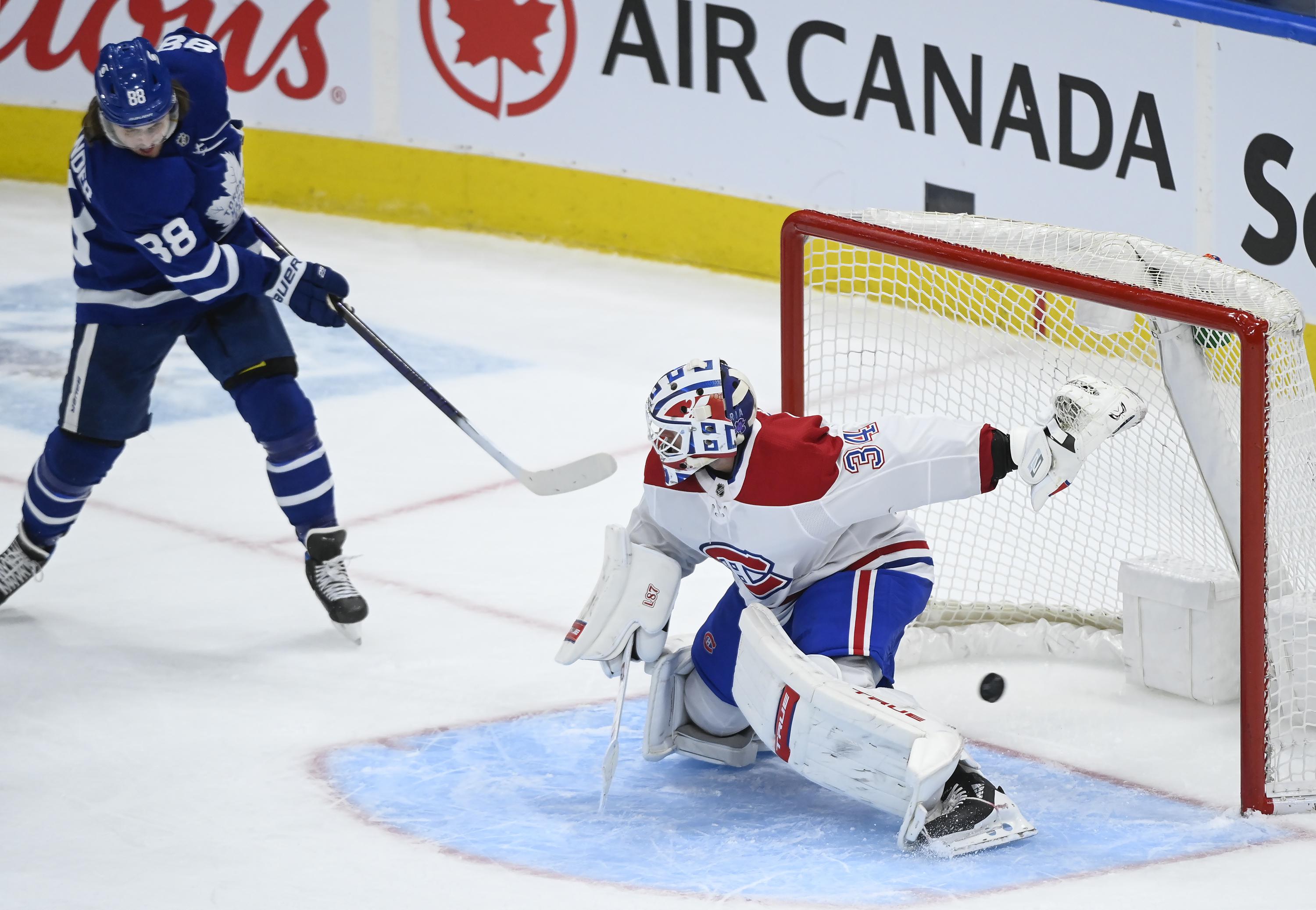 Maple Leafs wrap up North title, beating Canadiens 3-2 | AP News