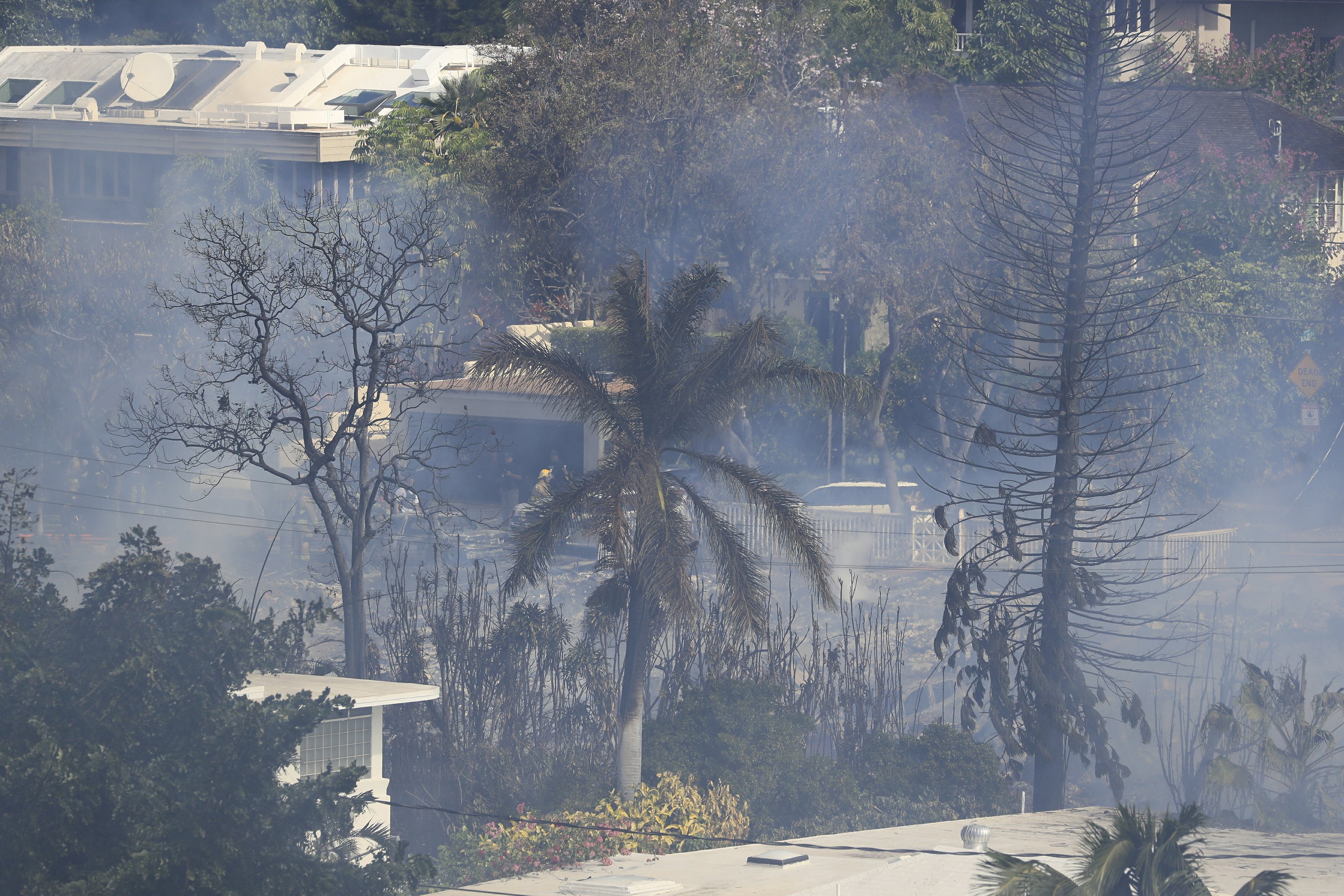 Homes burn after shooter kills 2 Honolulu officers | AP News