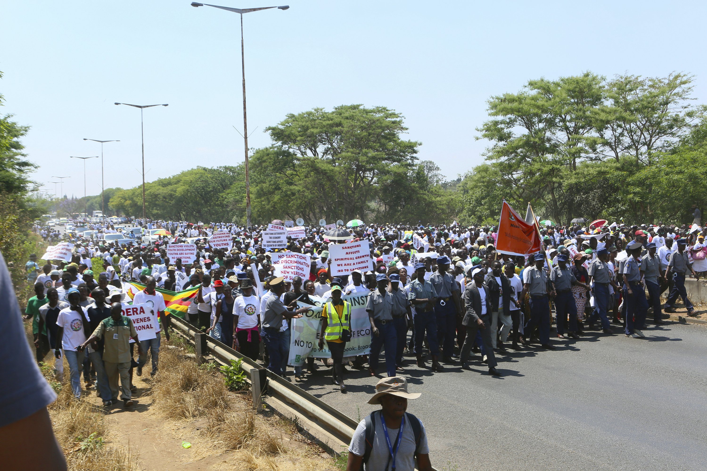 Hundreds rally during Zimbabwe's new anti-sanctions holiday | AP News
