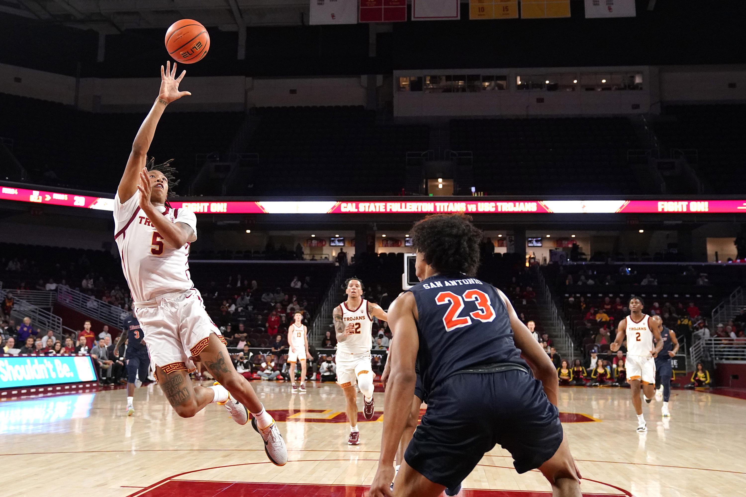 White scores 16, Johnson 14 as USC beats CSU Fullerton 64-50 | AP News