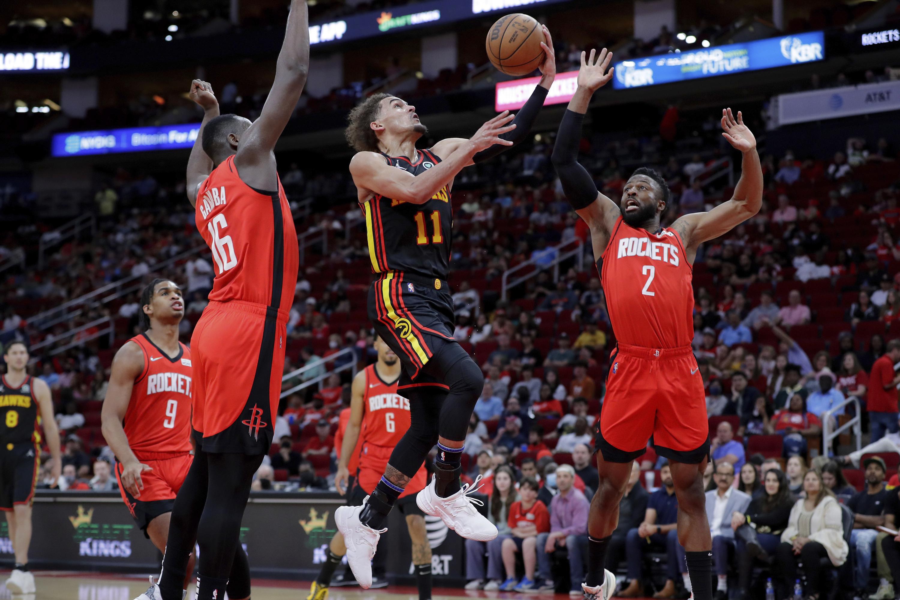 Hawks beat Rockets 130-114 but stay in 9th spot for play-in | AP News