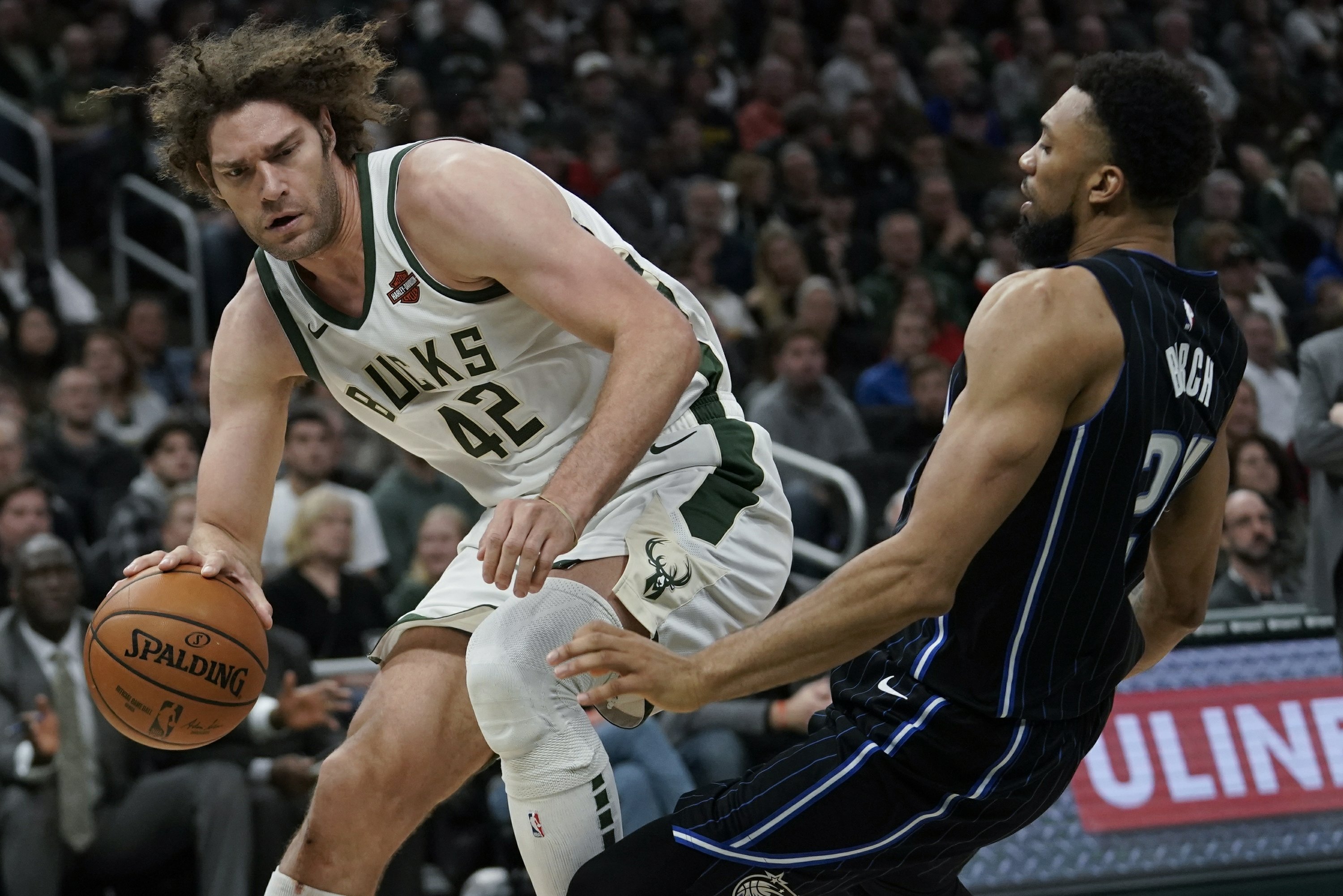 Bucks overcome Antetokounmpo's absence to beat Magic | AP News