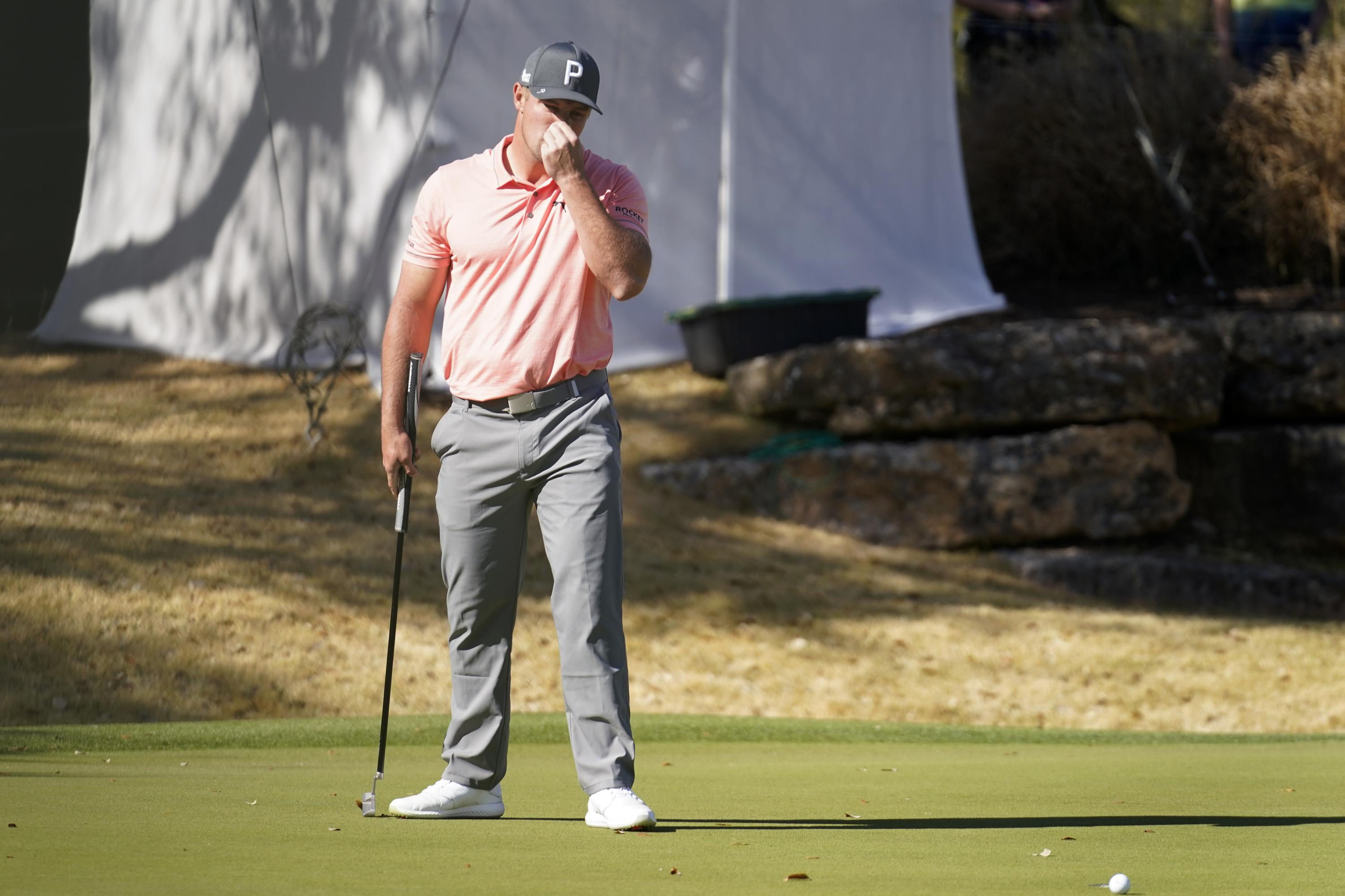 A day of big comebacks and early elimination at Match Play | AP News
