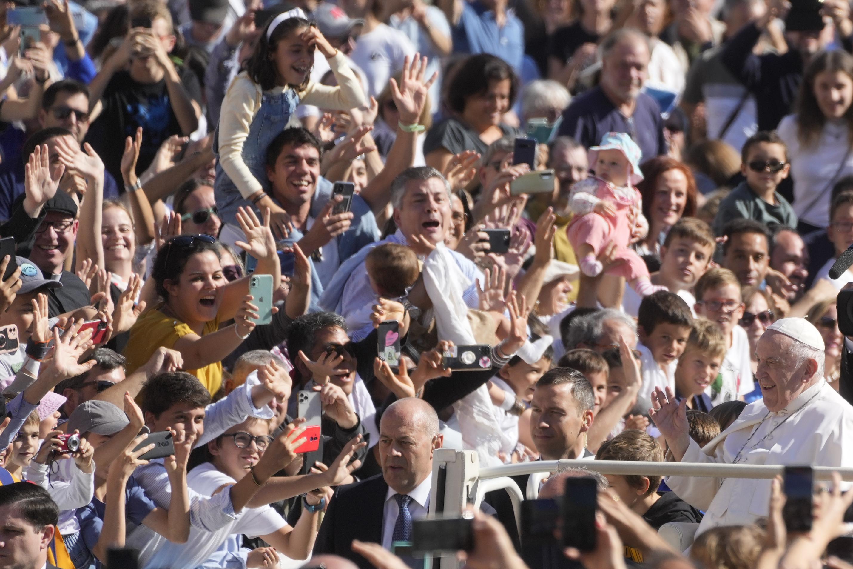 Pope gives pep talk to big lay group after tightening rules | AP News