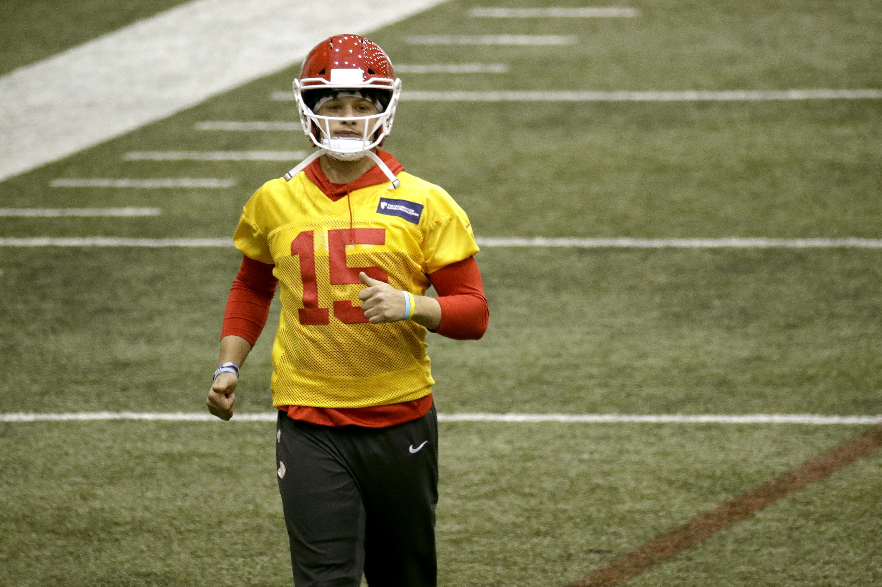 Chiefs' Mahomes leads way with his legs, not just his arm | AP News