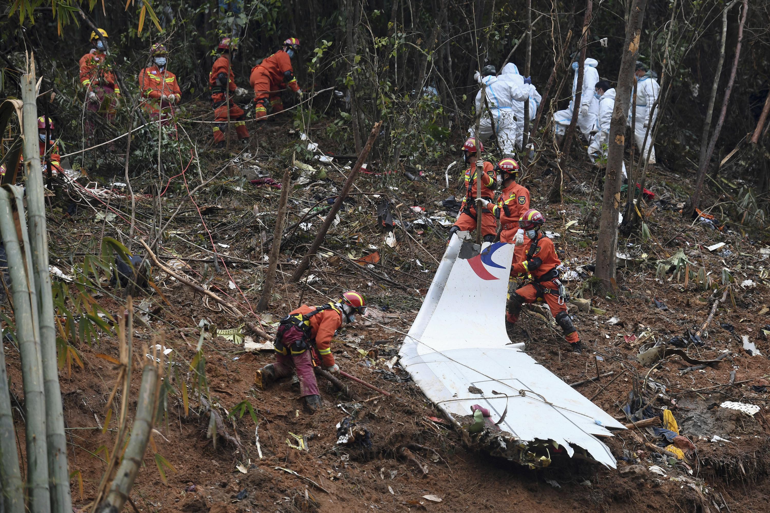Searchers in China find wing, engine parts after plane crash | AP News