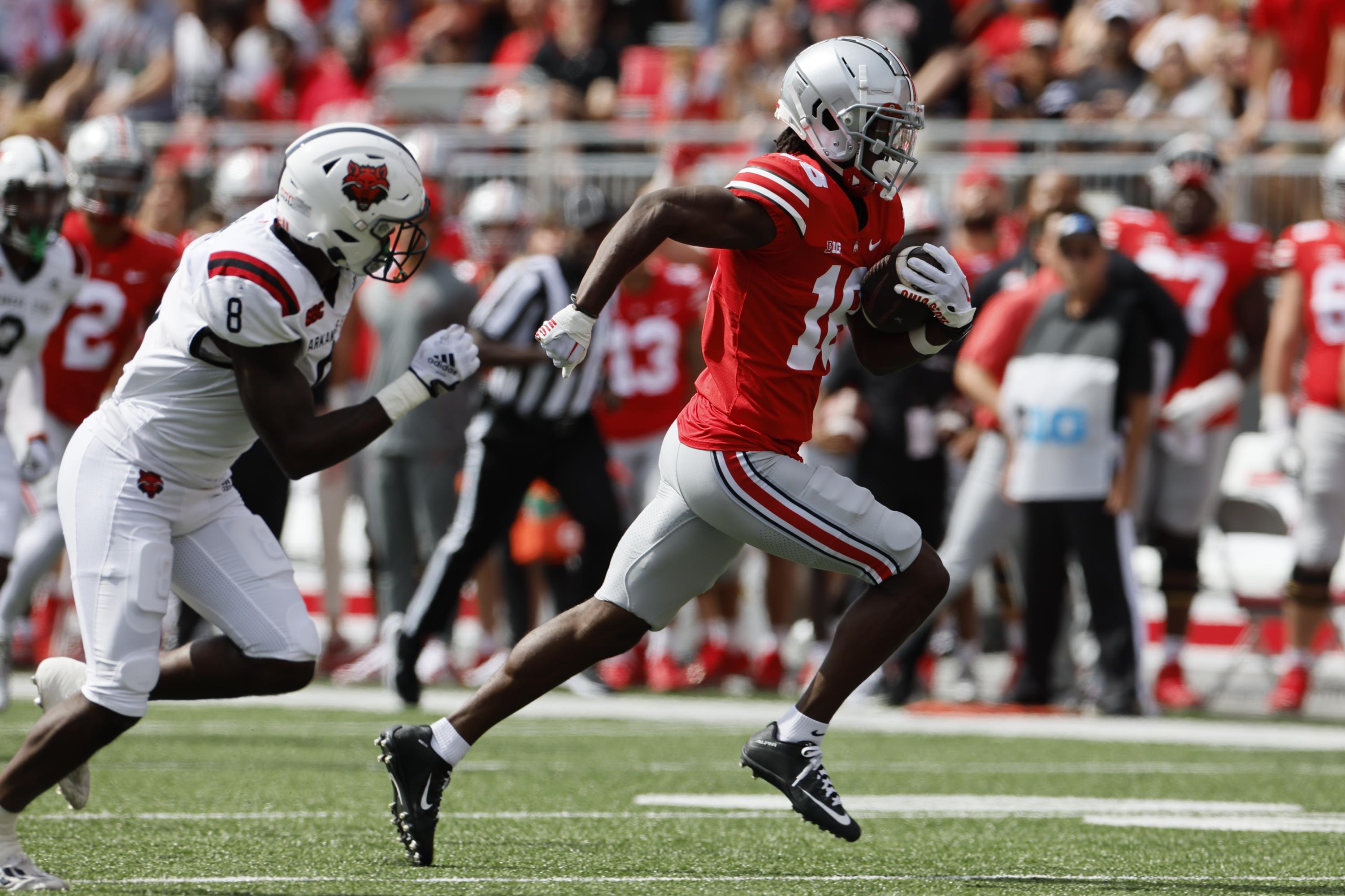 Harrison grabs 3 TDs, No. 3 Buckeyes rout Arkansas St 45-12 | AP News