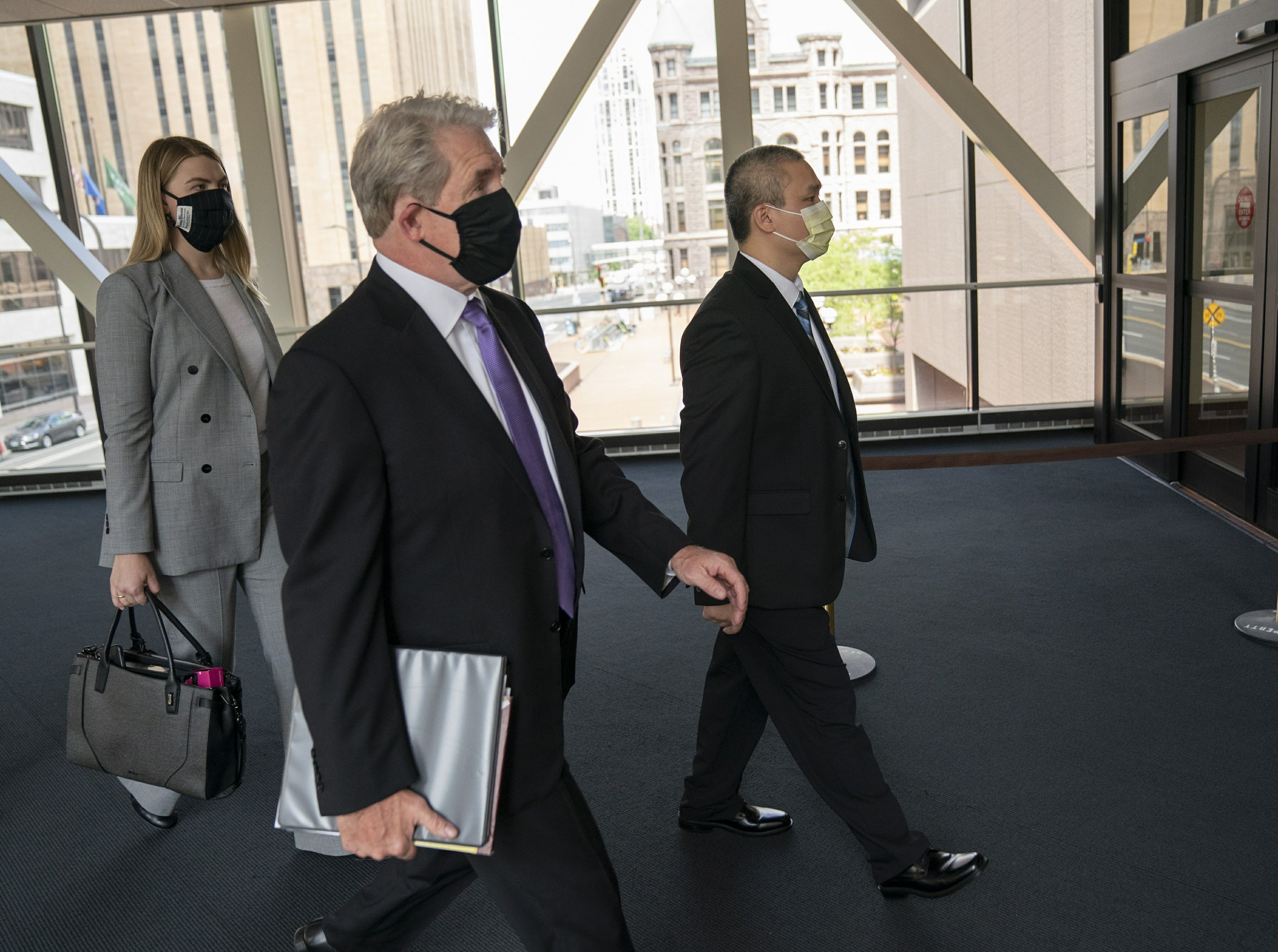 Prosecutors depict ex-officer as complicit in Floyd's death | AP News