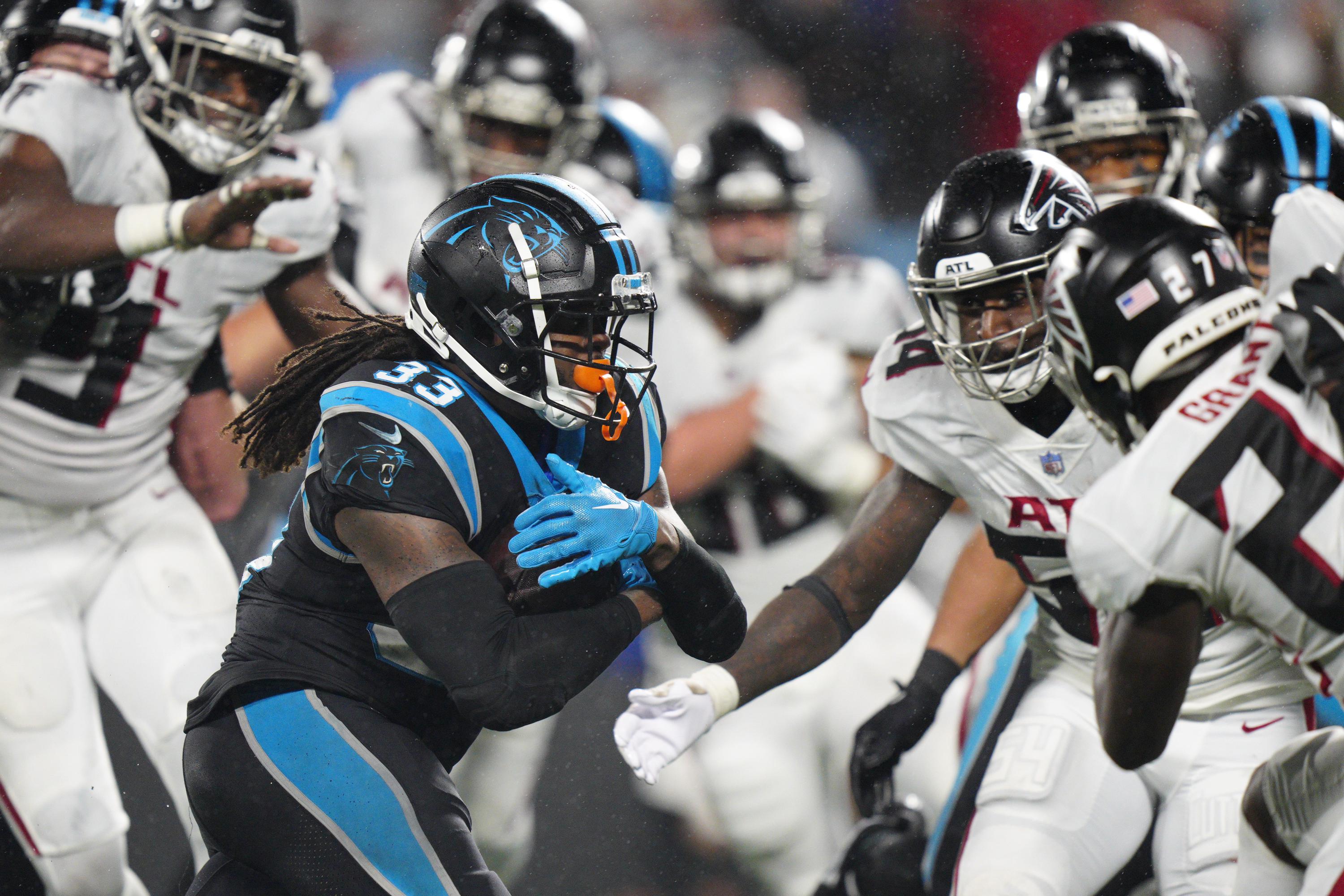 Foreman leads Panthers past rival Falcons in rain, 25-15 | AP News