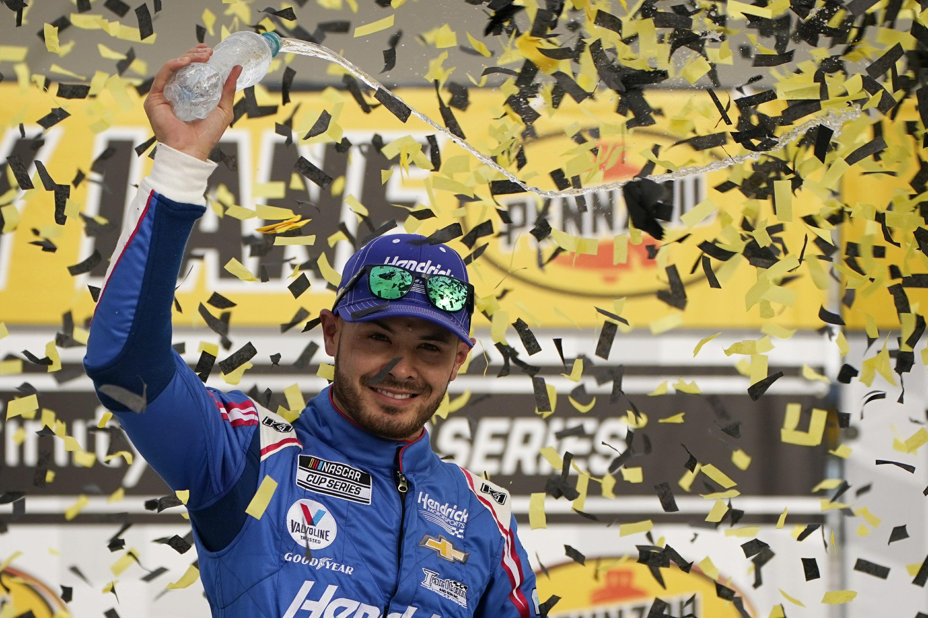 Kyle Larson celebrates return with 1st win since suspension | AP News