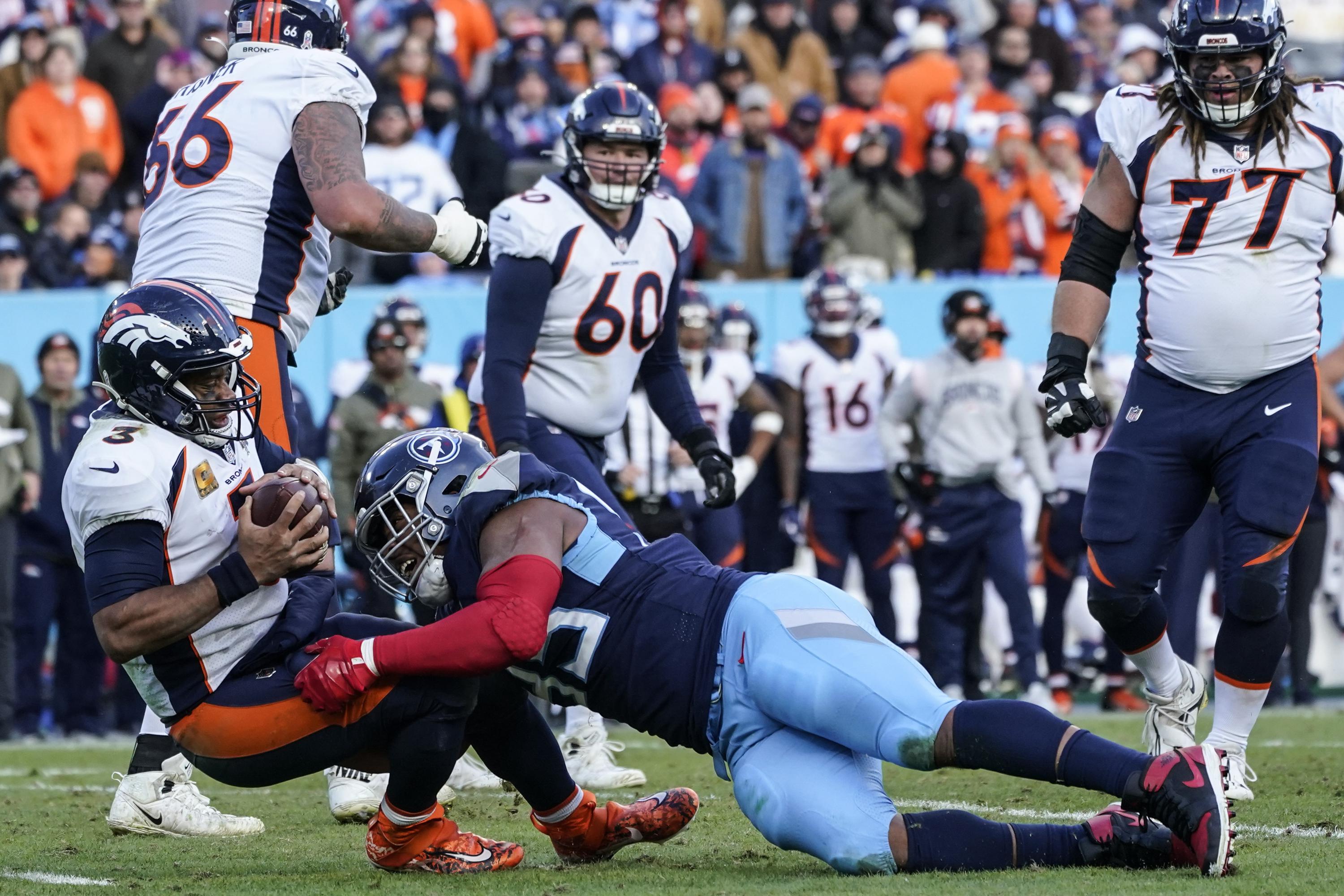Wilson sacked 6 times, picked off late as Denver loses again | AP News