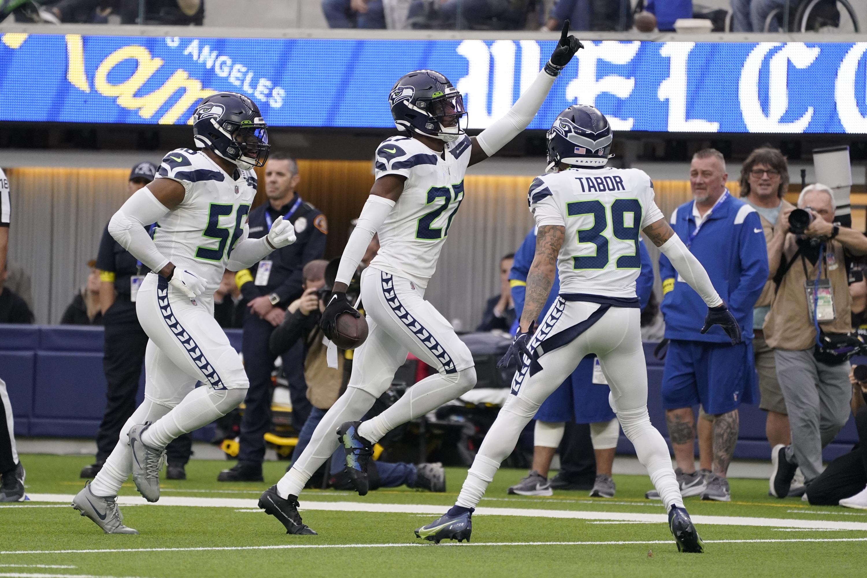 Woolen still learning in standout rookie season for Seahawks | AP News
