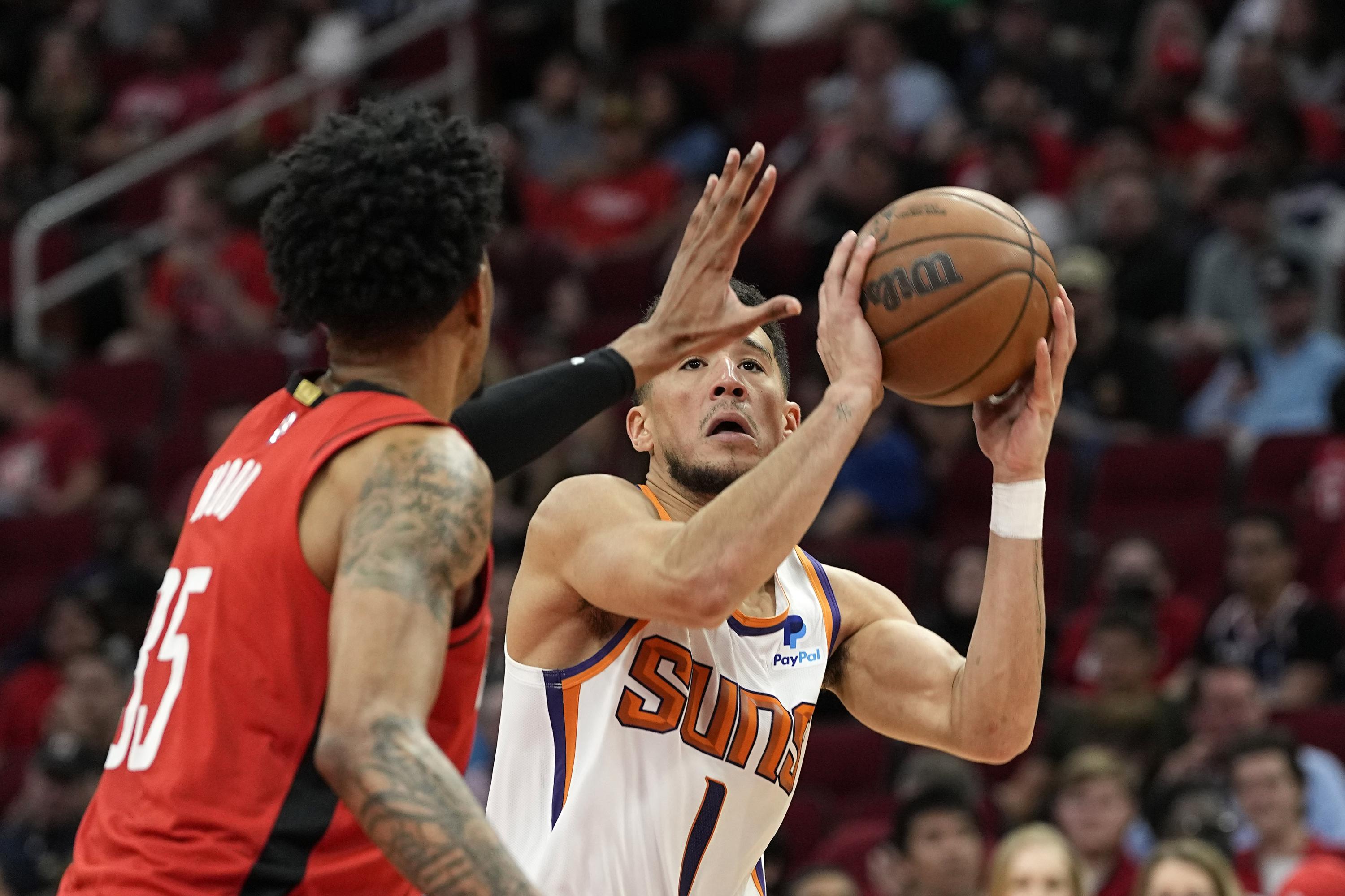 Booker anota 36; Suns, líderes de NBA, vencen a Rockets | AP News