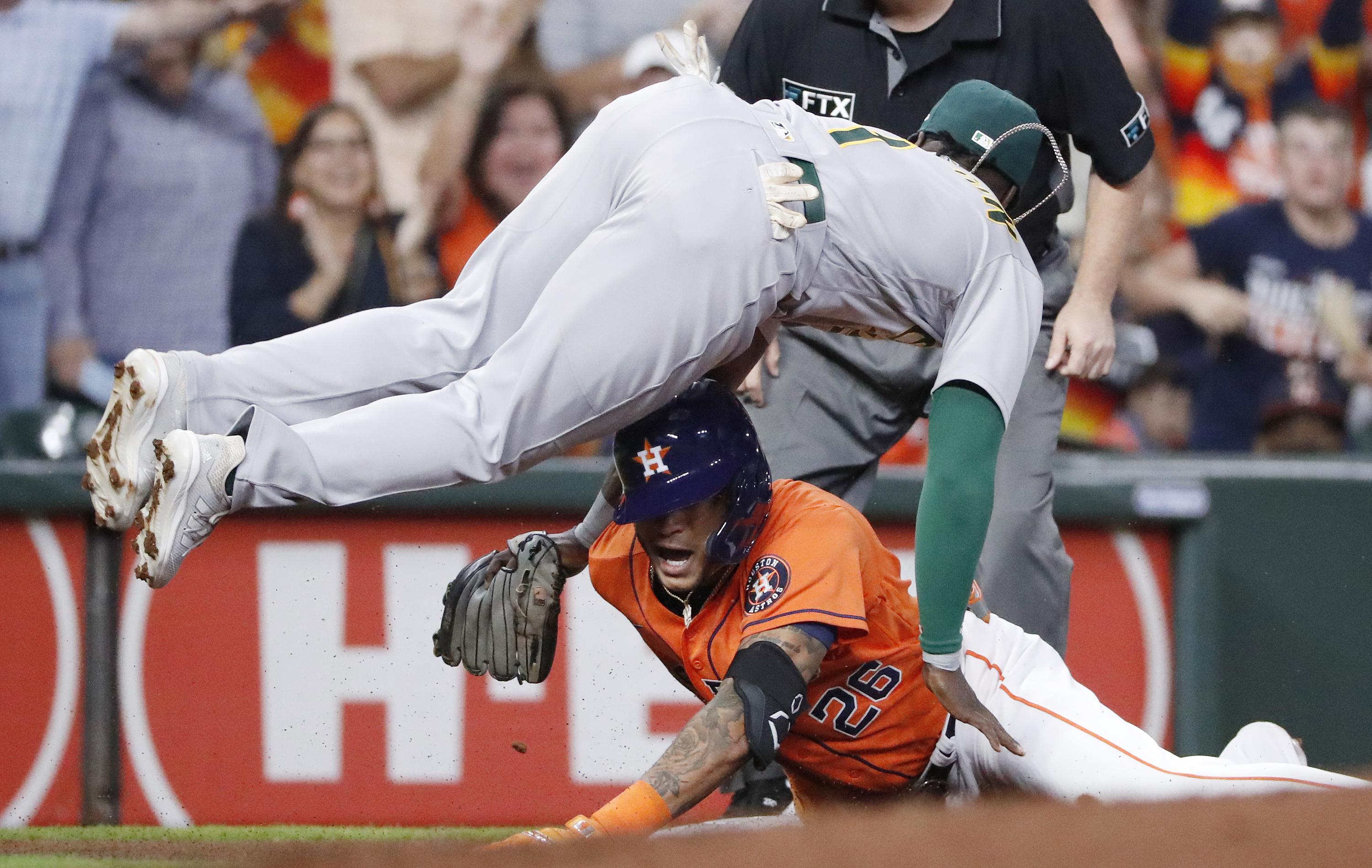 Astros' edge for home field in playoffs cut with loss to A's | AP News