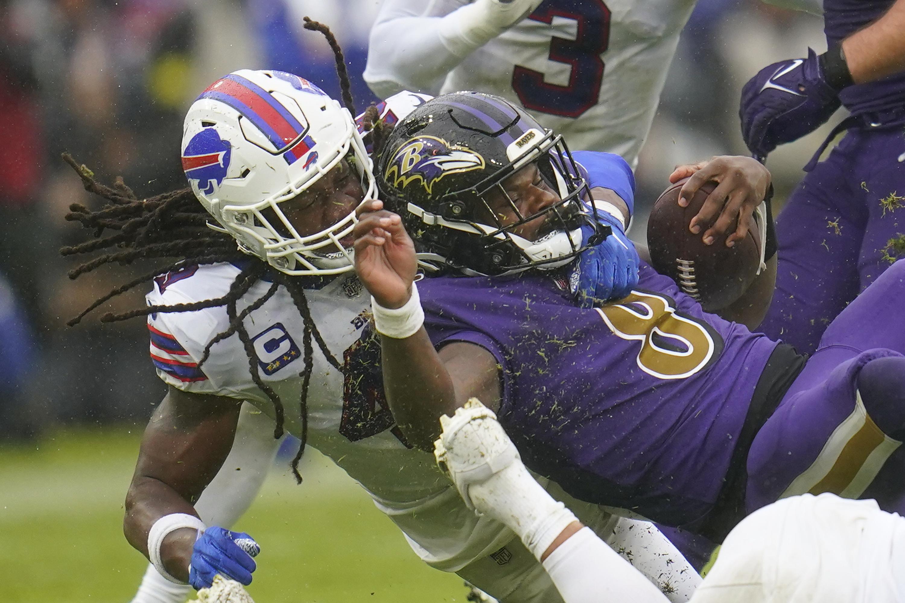 Ravens' Harbaugh stands by 4th-down call in loss to Bills | AP News