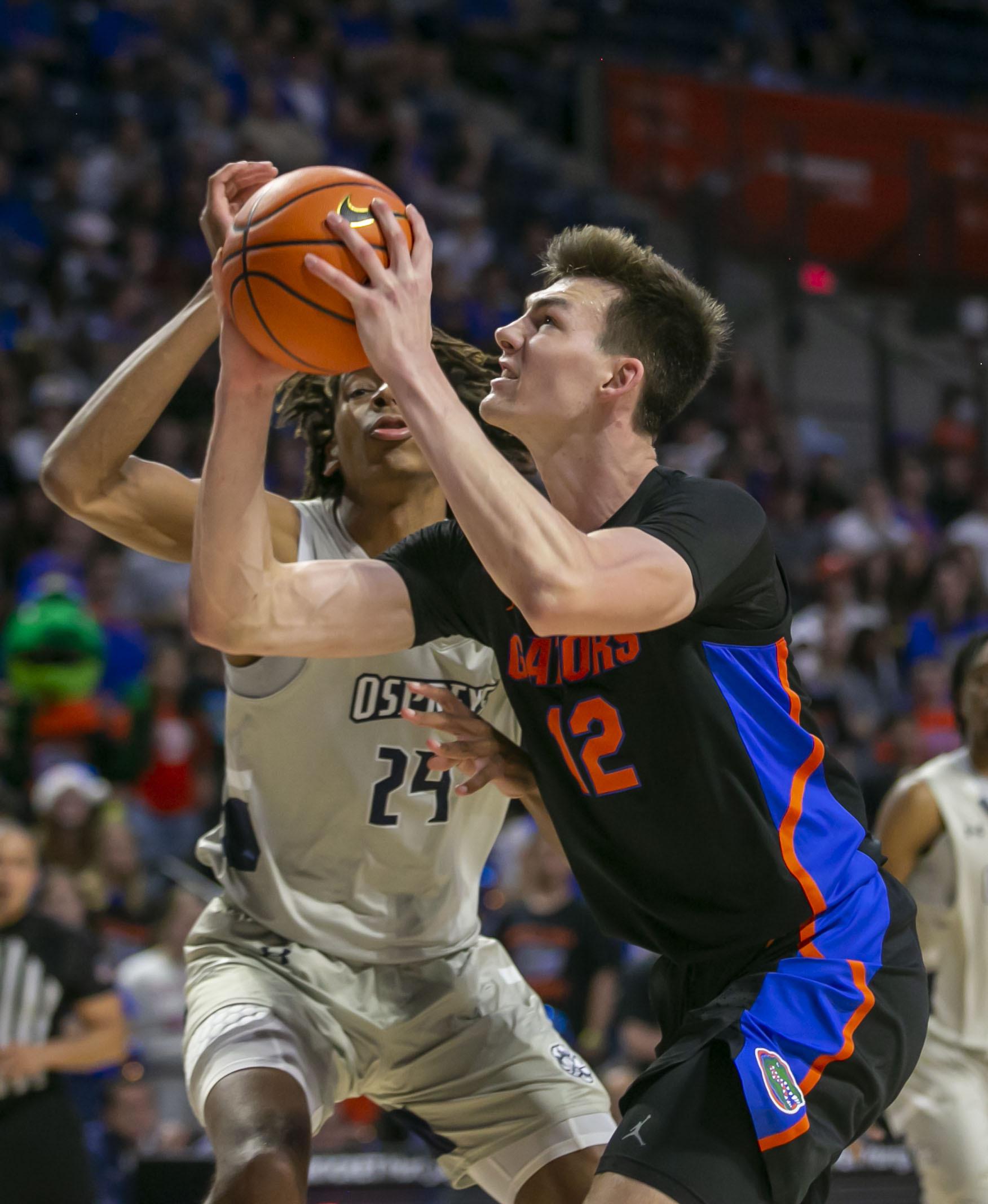 No. 20 Florida bounces back from stunner, handles UNF 85-55 | AP News