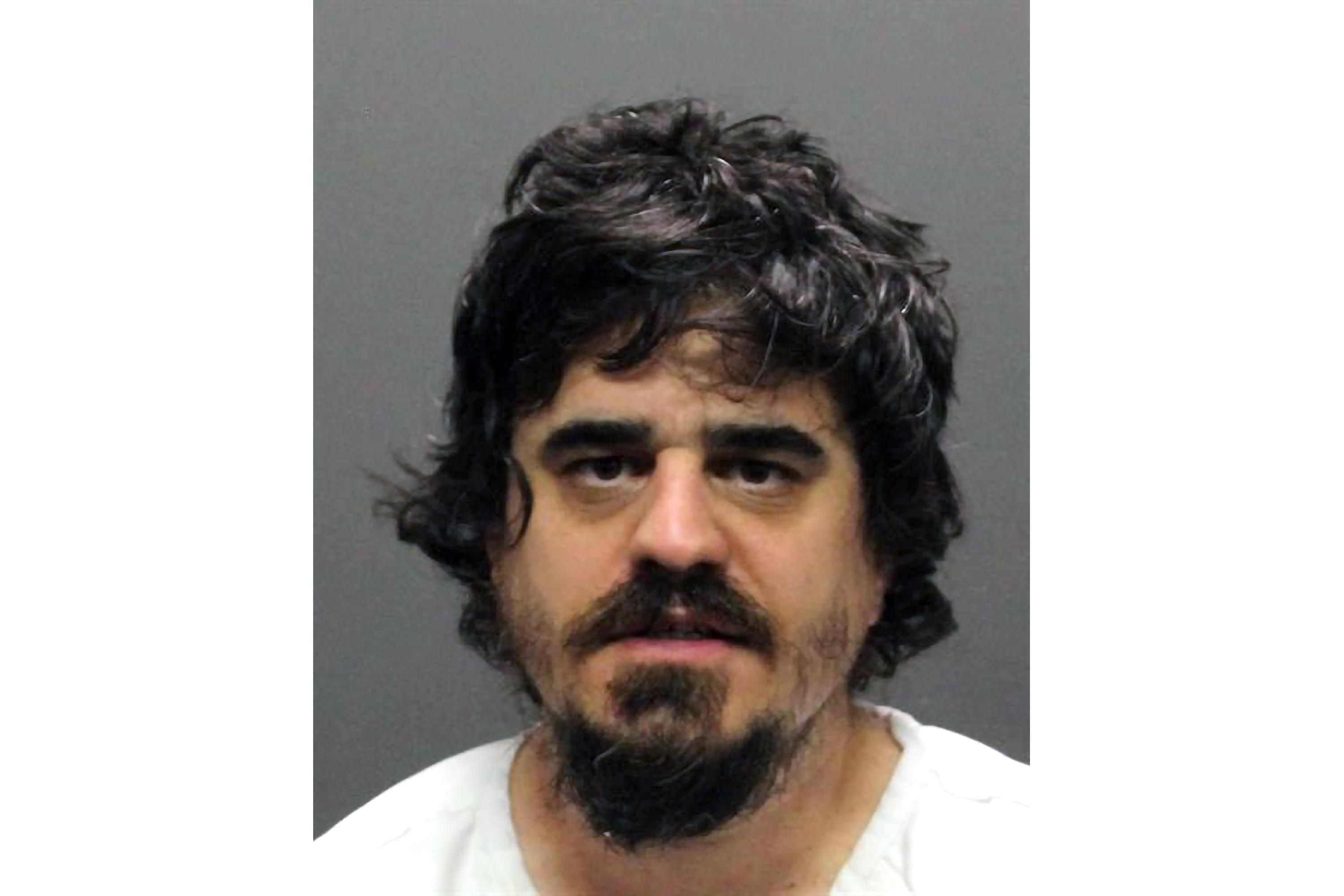 Ex-grad student held in Arizona professor's fatal shooting | AP News