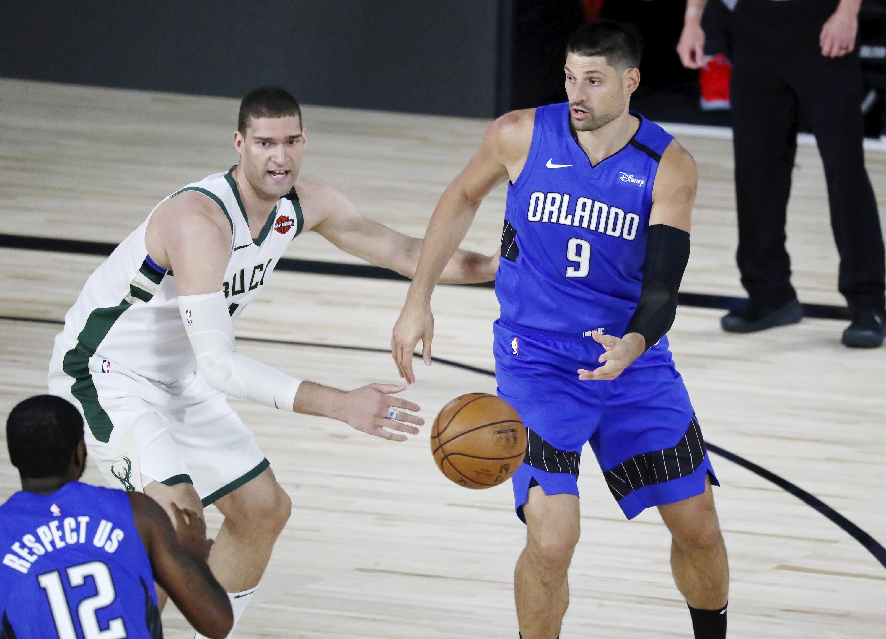 Vucevic, Magic upset top-seeded Bucks in series opener | AP News