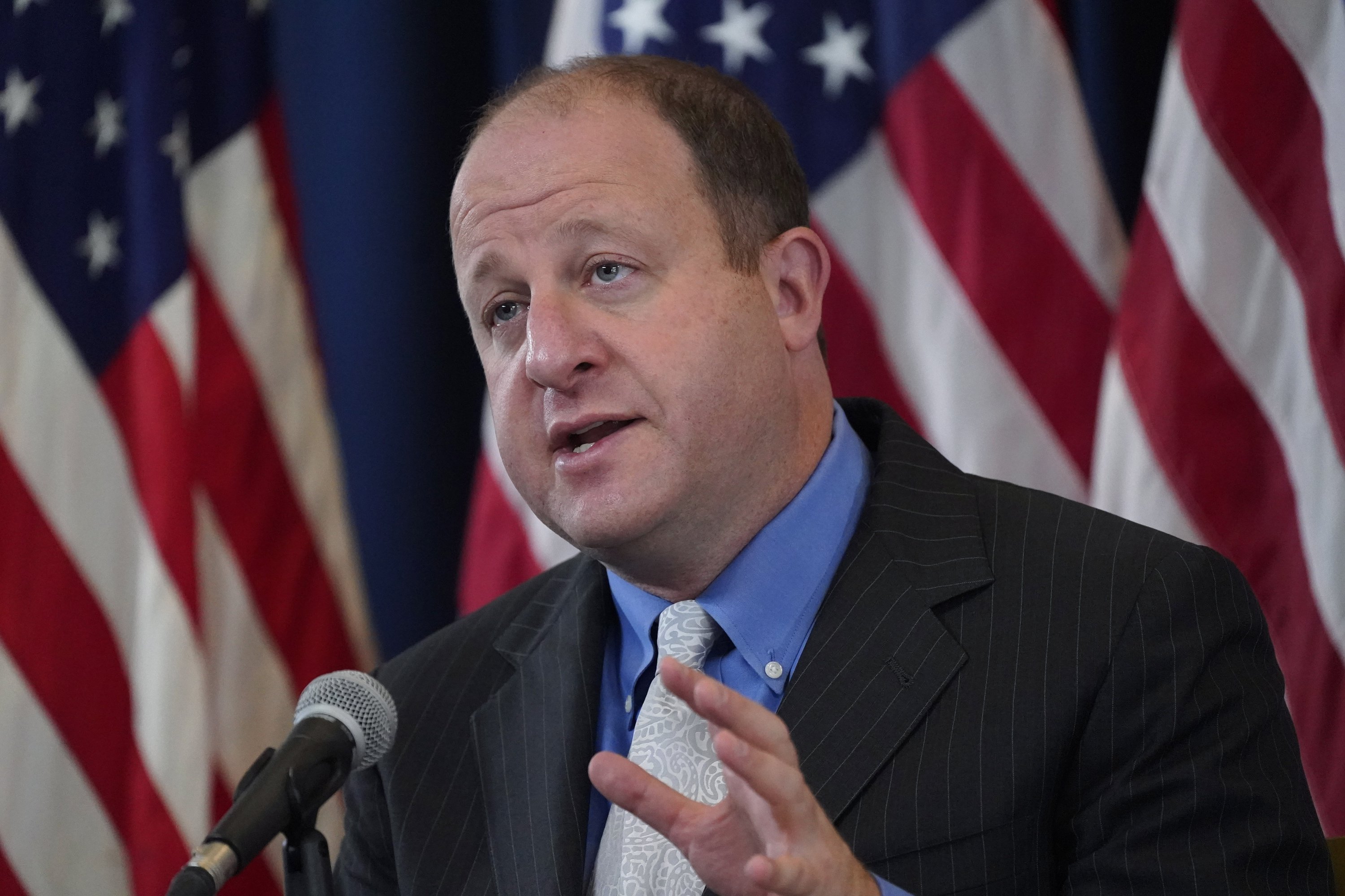 Colorado governor appeals to residents to stem virus uptick | AP News