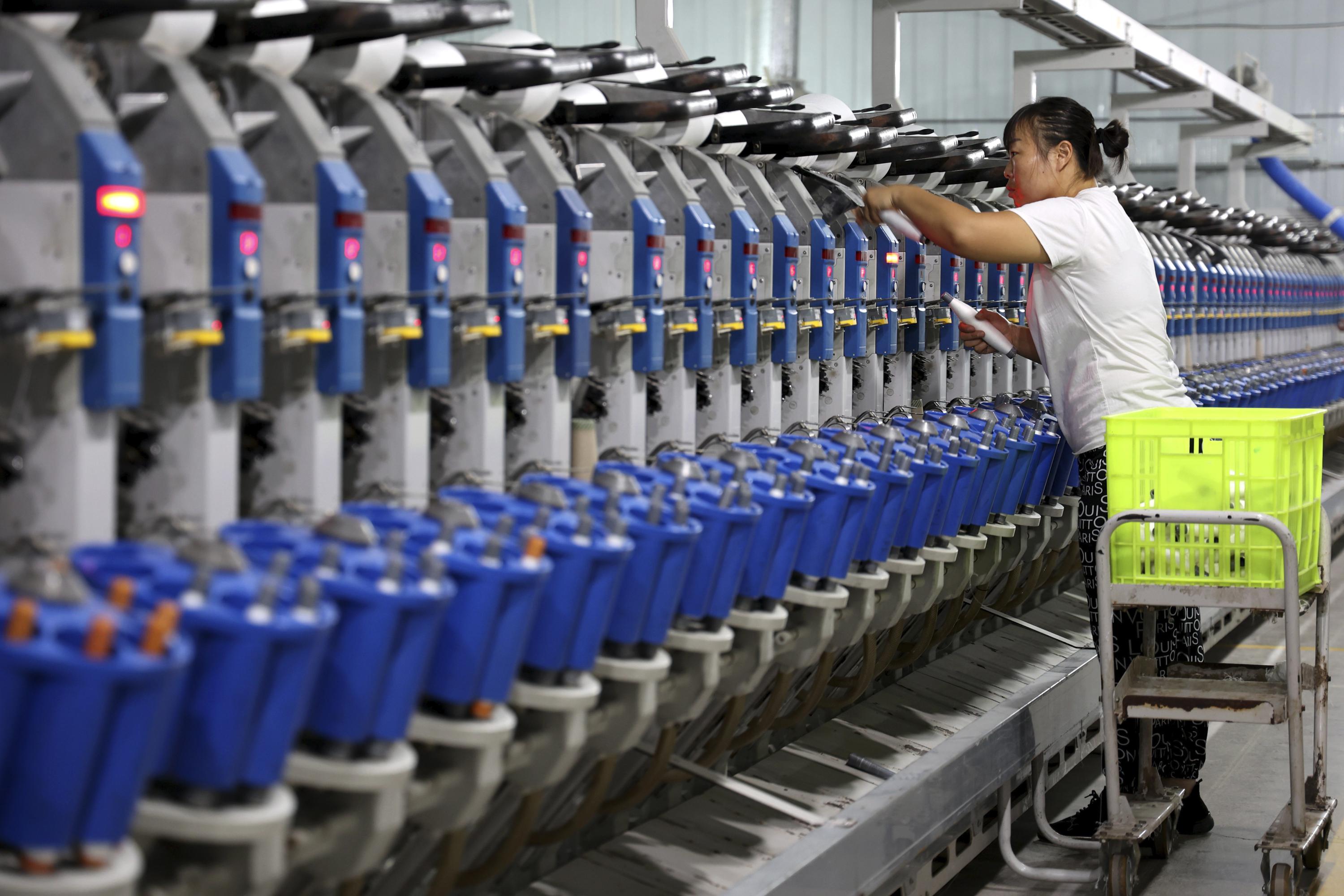 China consumer, factory activity down as virus controls rise | AP News