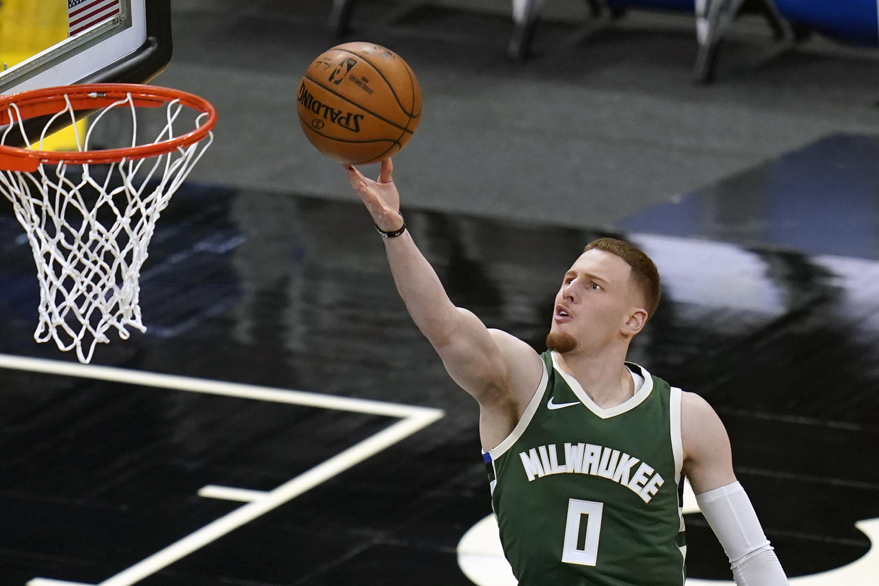 Bucks' DiVincenzo savors return to action after long absence | AP News