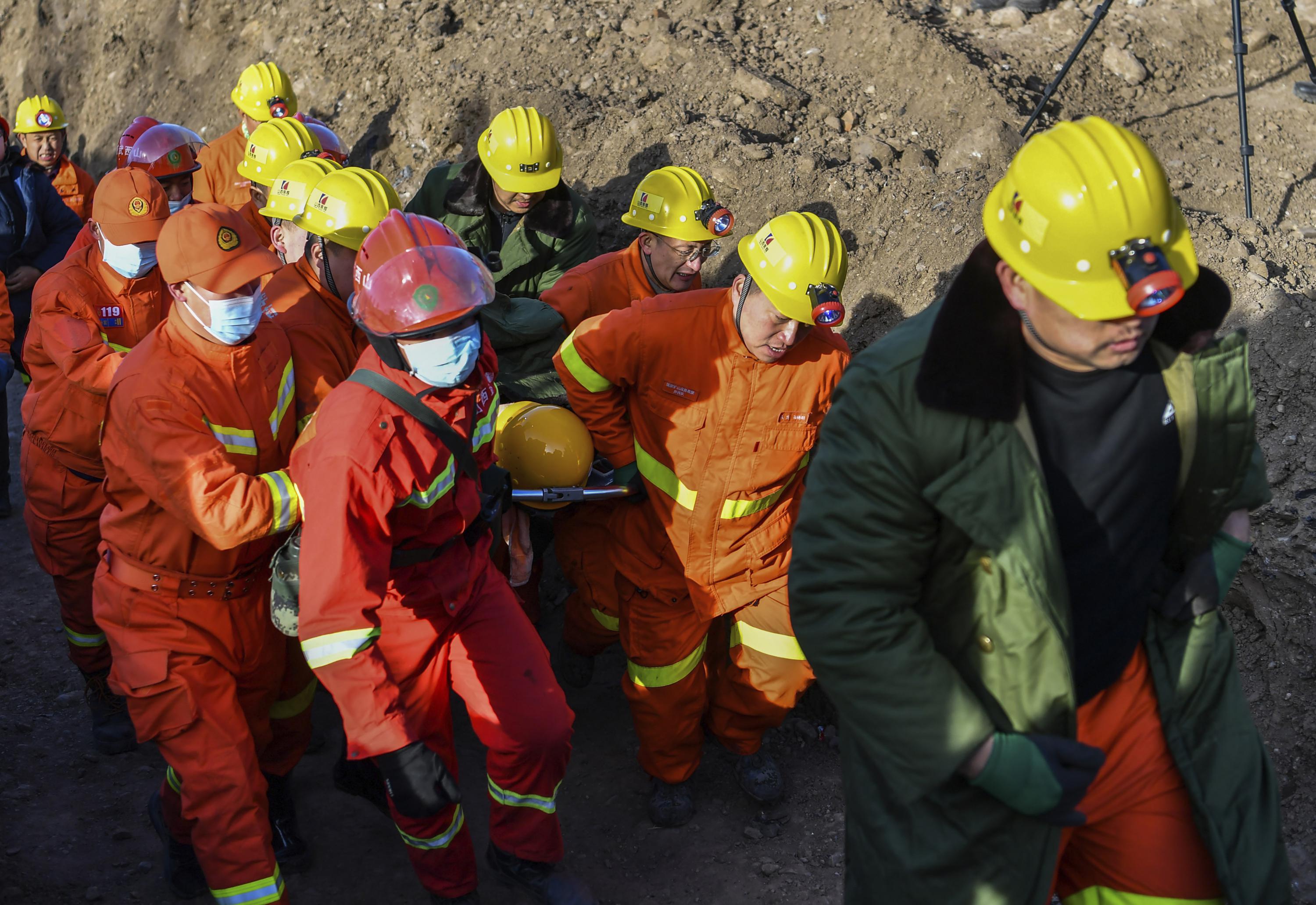 20 Chinese miners rescued from flooded shaft, 2 found dead | AP News