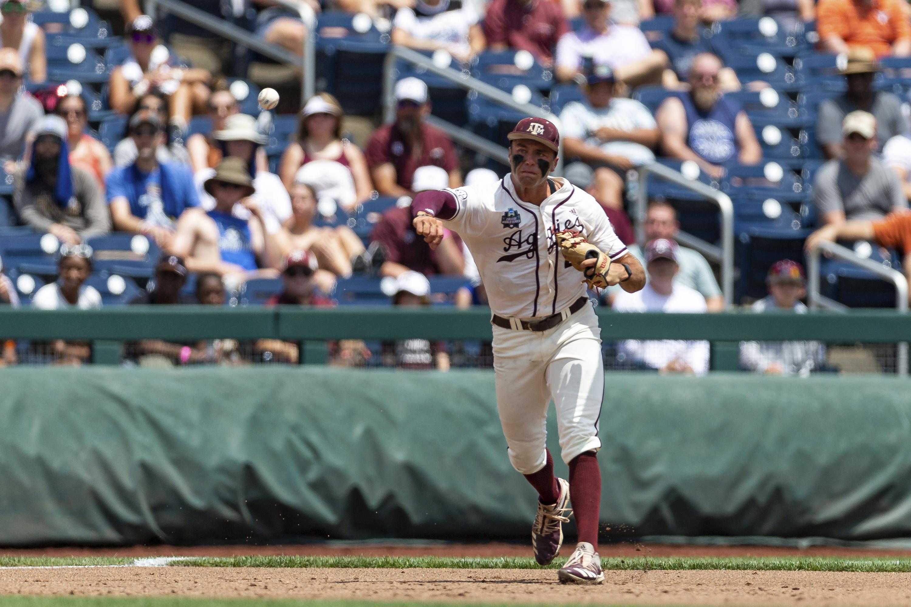 Texas A&M ousts rival Longhorns from CWS with 10-2 victory | AP News