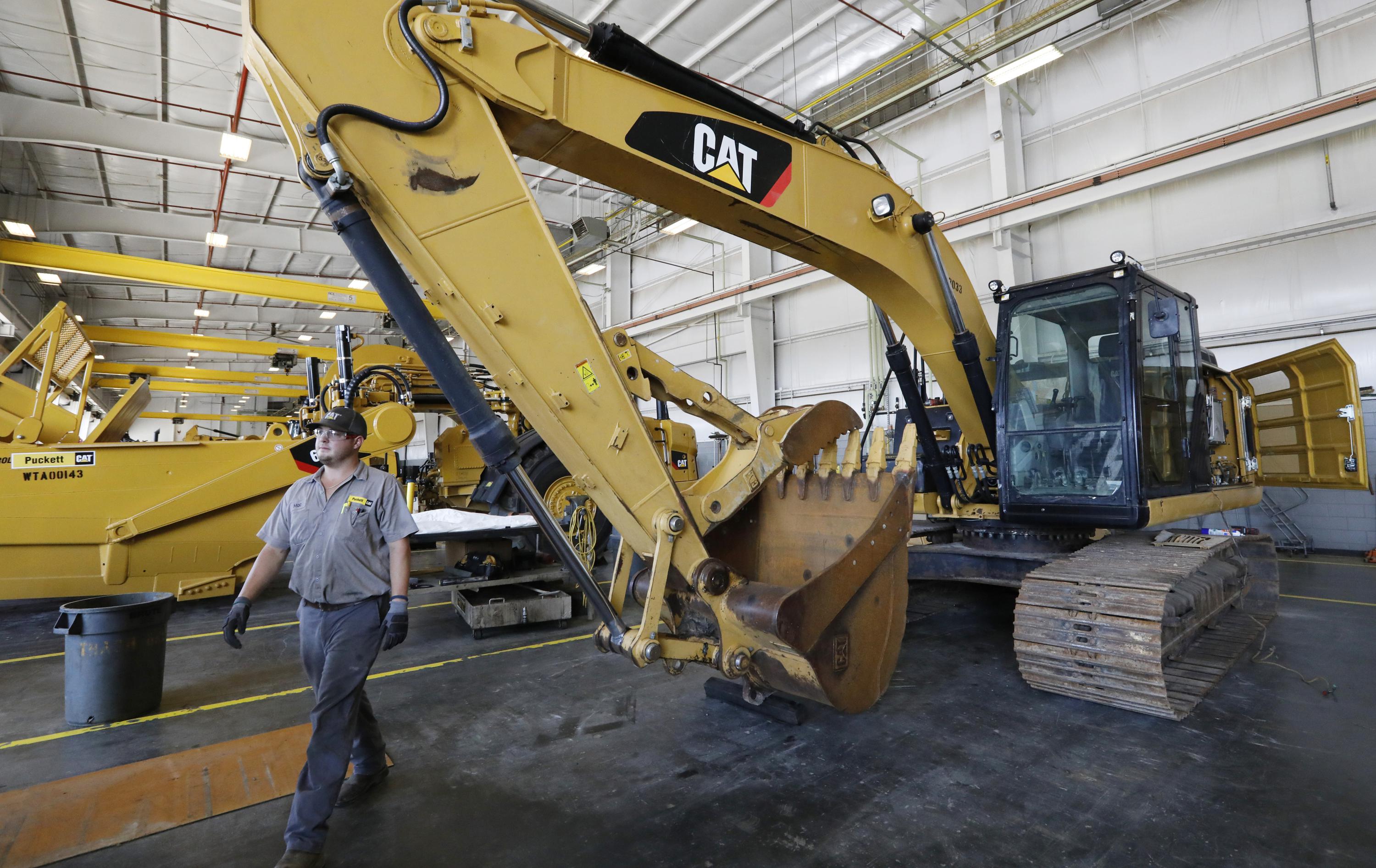 Huge demand at Caterpillar, but global supply constrains | AP News