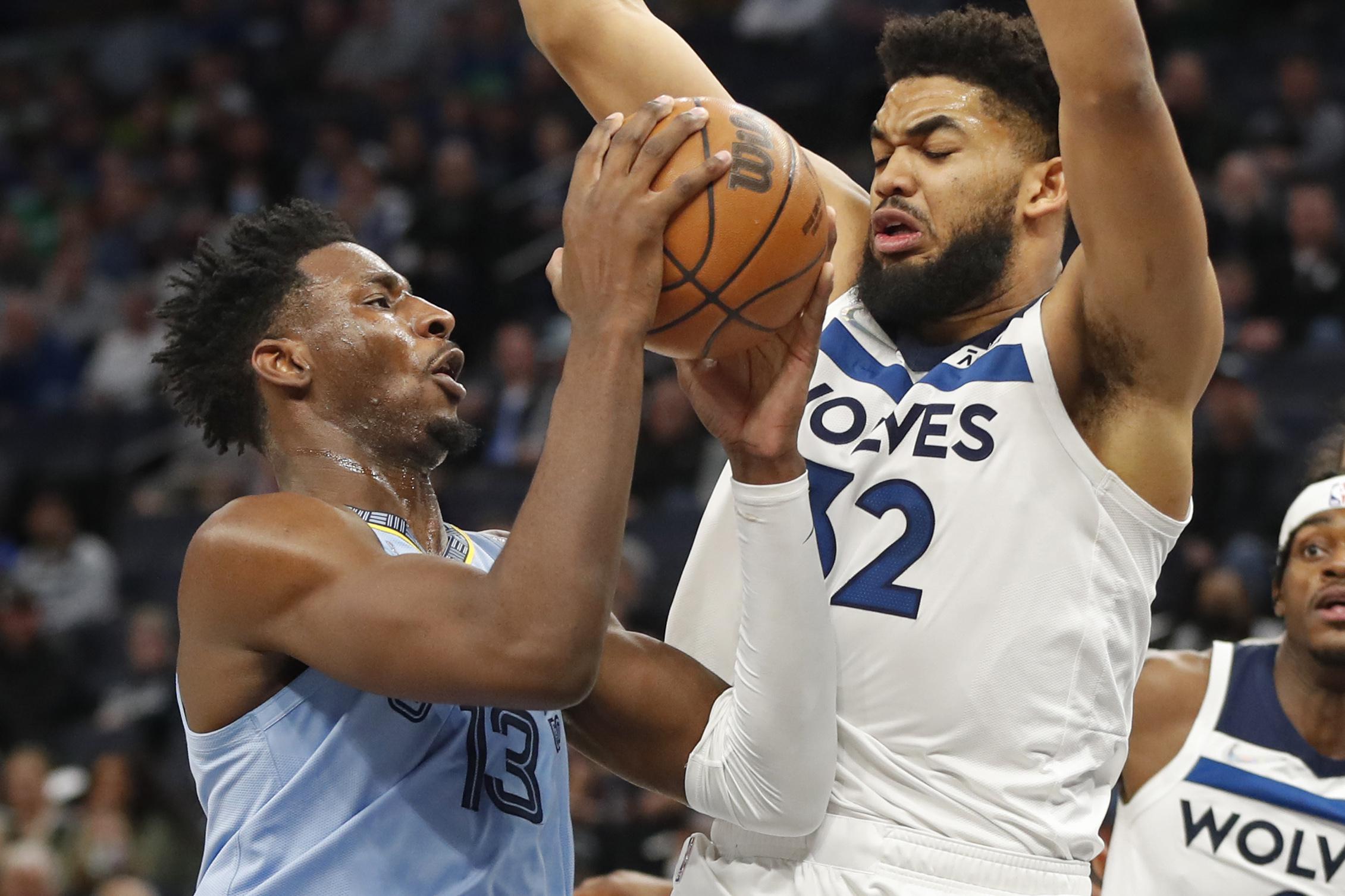 Russell scores 37, leads T-wolves past Grizzlies 119-114 | AP News