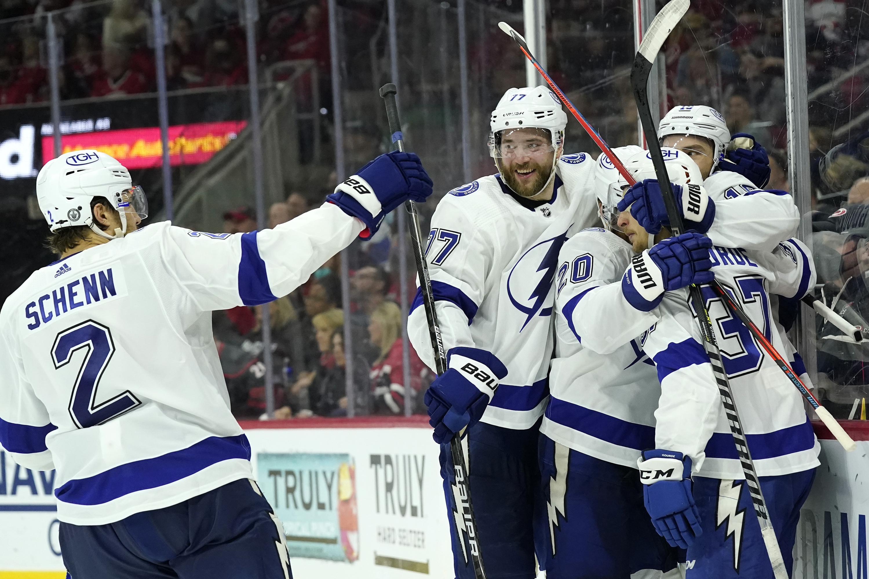 Goodrow helps Lightning beat Hurricanes 2-1 in series opener | AP News