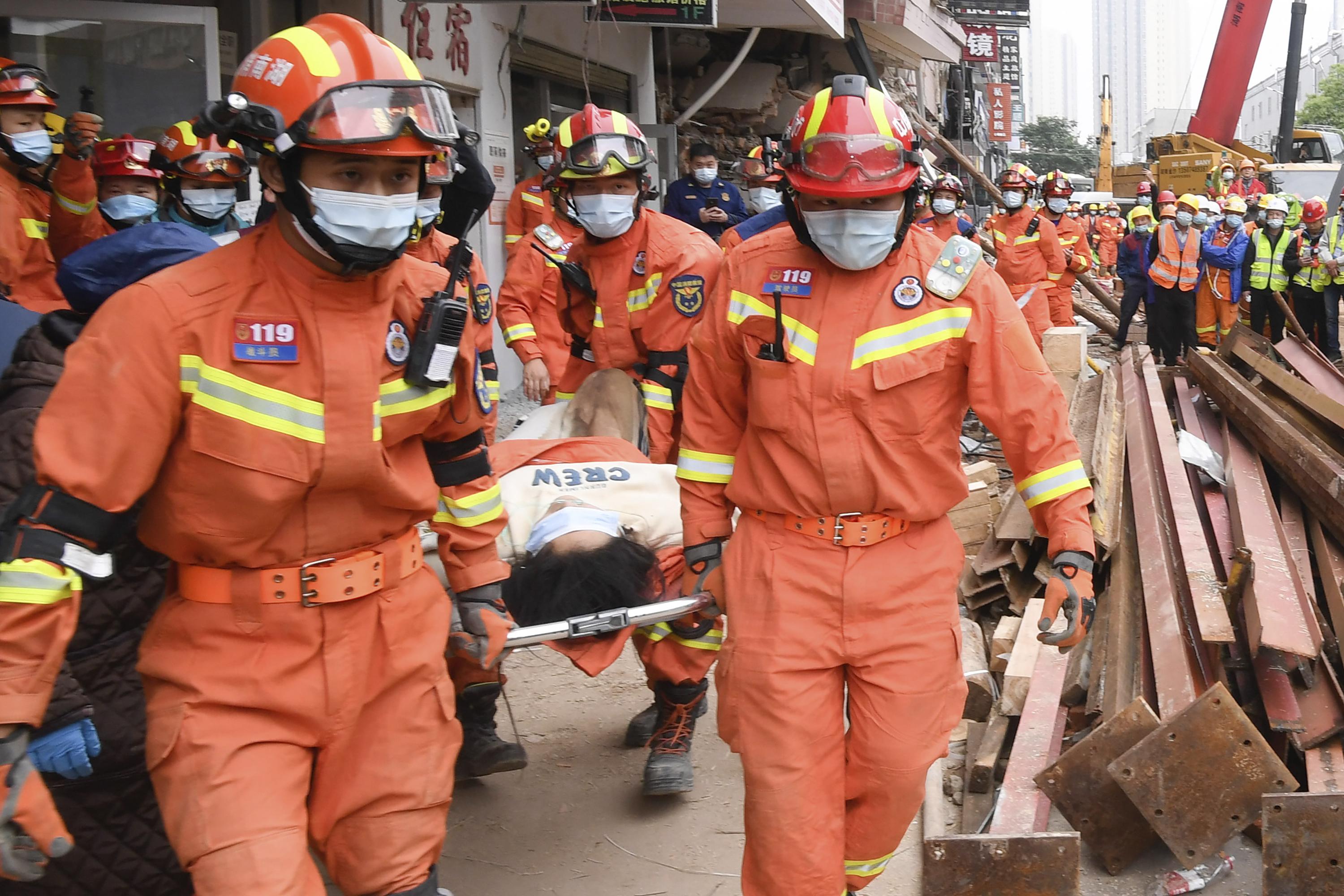 2 people rescued 50 hours after China building collapse | AP News