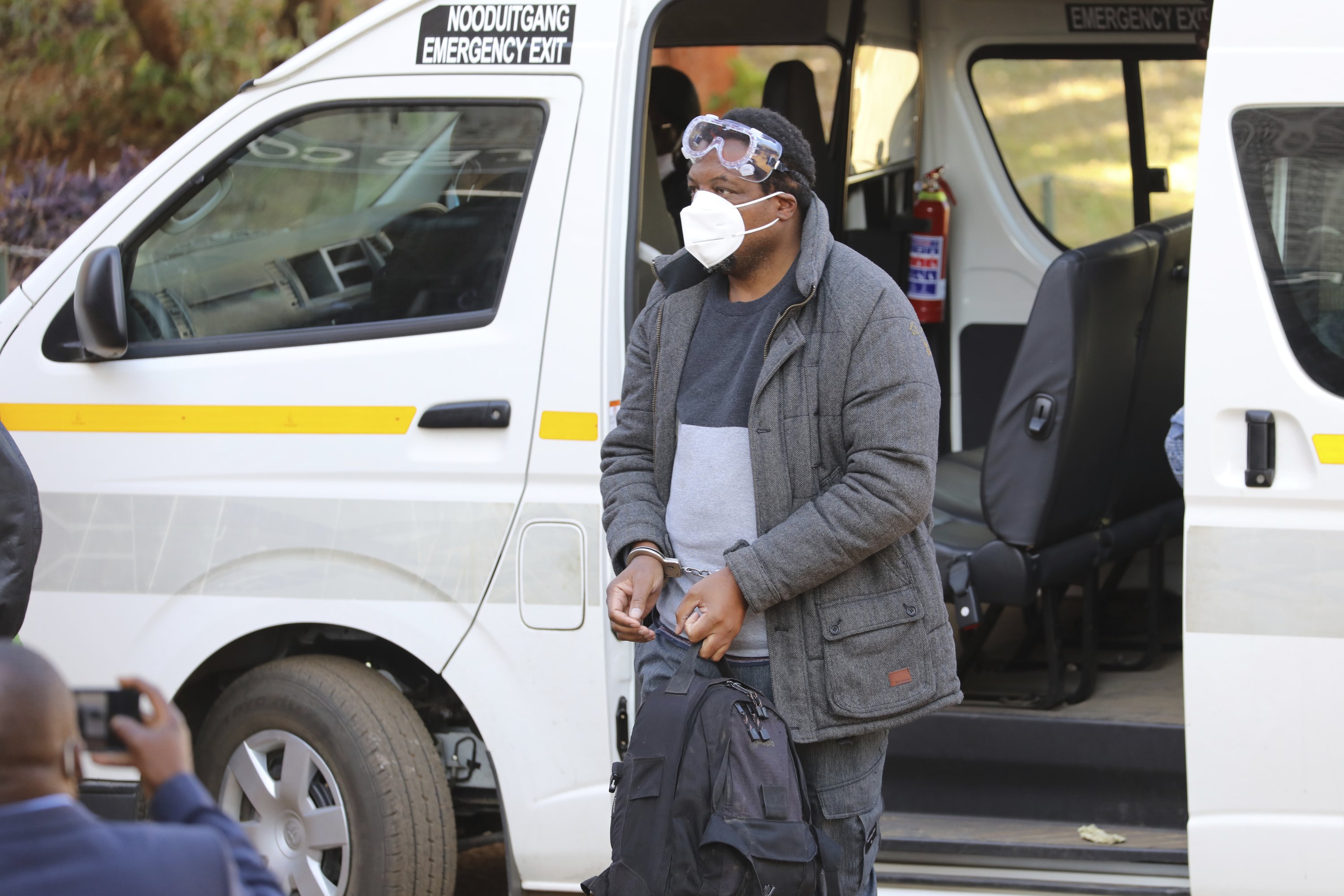 Zimbabwean journalist, opposition figure appear at court | AP News